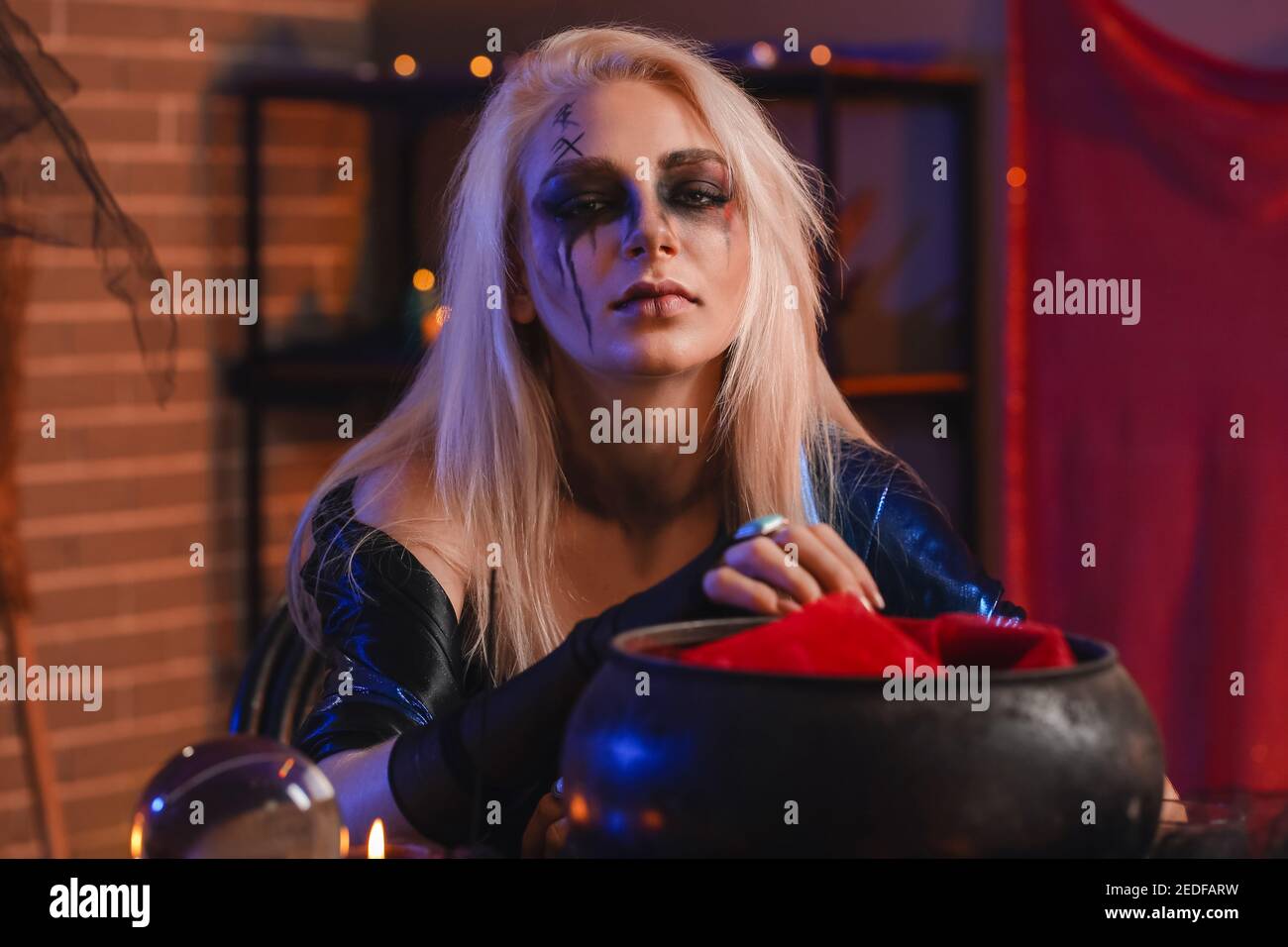 Witch performing black magic ritual Stock Photo - Alamy