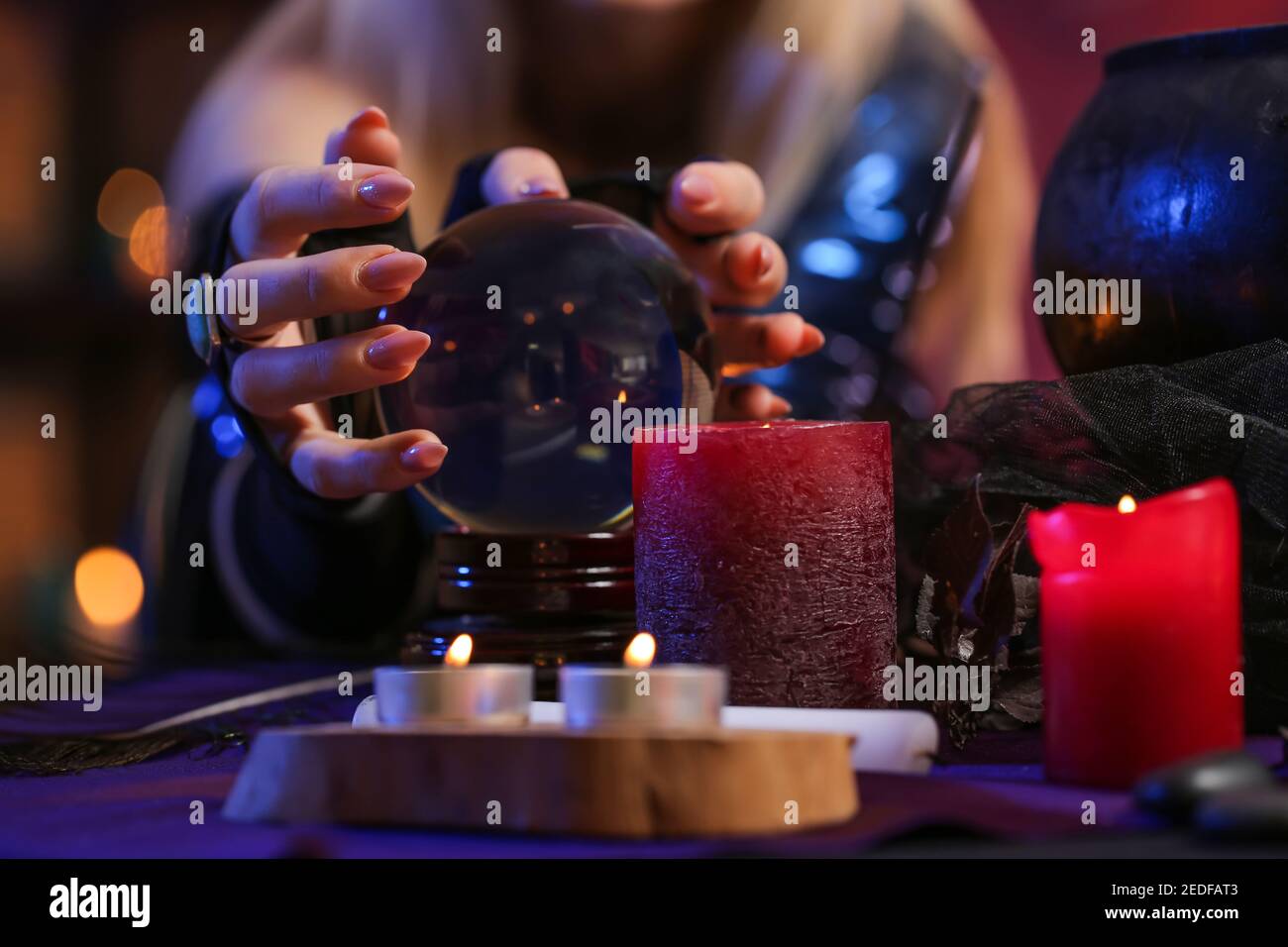 Fortune teller with crystal ball, closeup Stock Photo - Alamy