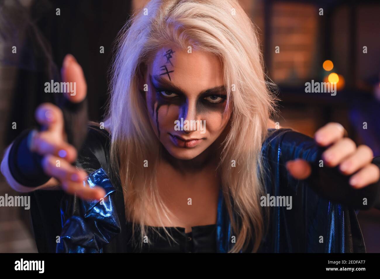 Witch performing black magic ritual Stock Photo - Alamy
