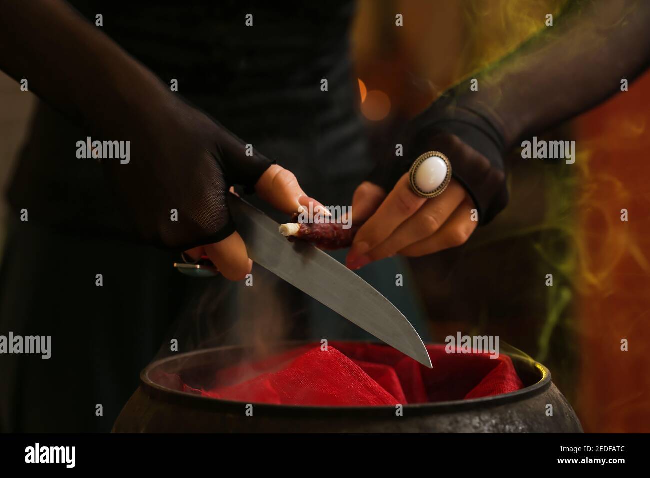 Witch making potion during black magic ritual, closeup Stock Photo - Alamy
