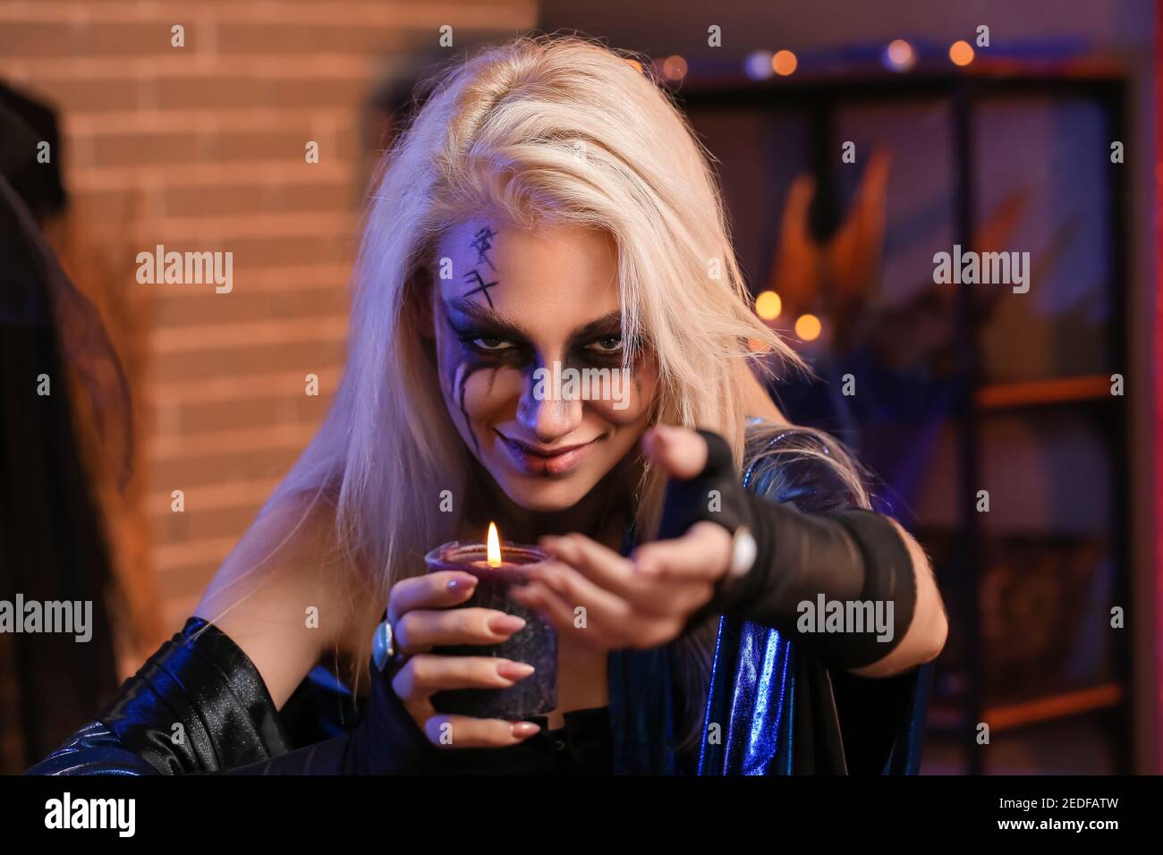 Witch performing black magic ritual Stock Photo - Alamy