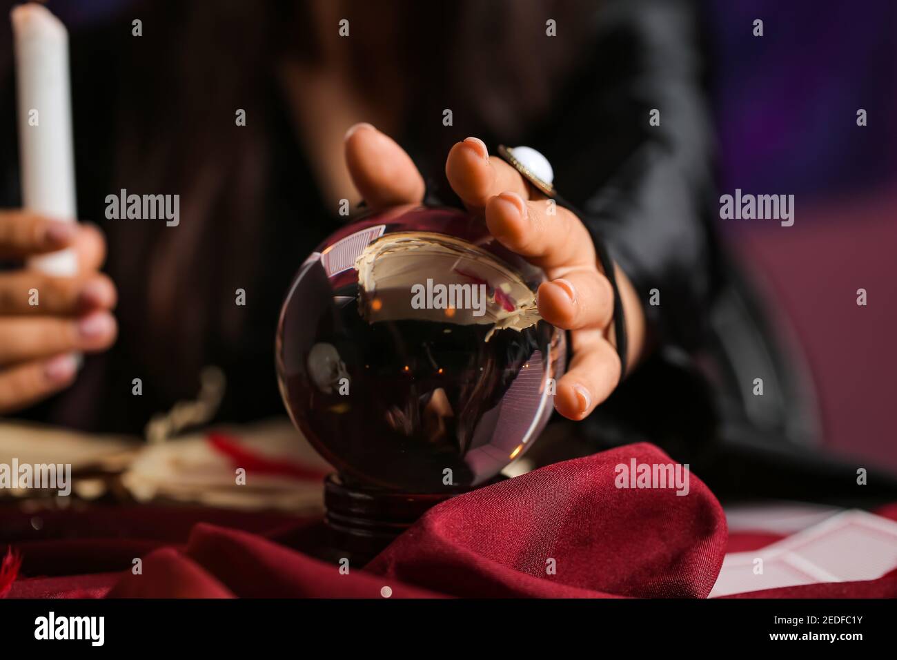 Fortune teller with crystal ball reading future, closeup Stock Photo ...