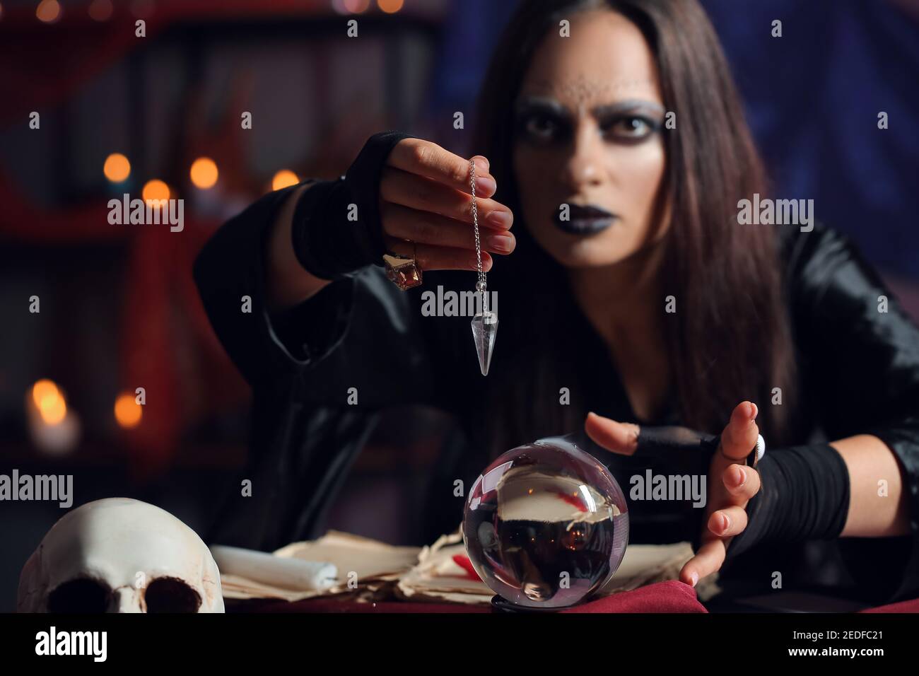 Witch performing black magic ritual Stock Photo - Alamy
