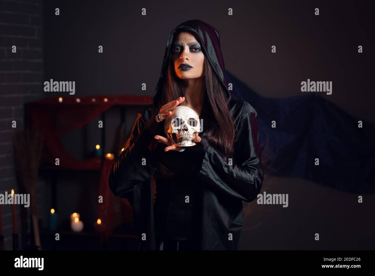 Witch performing black magic ritual Stock Photo - Alamy