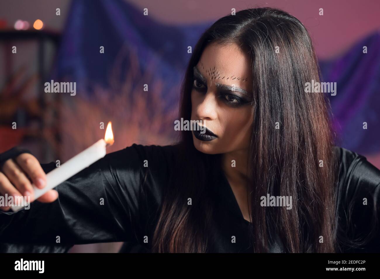 Witch performing black magic ritual Stock Photo - Alamy