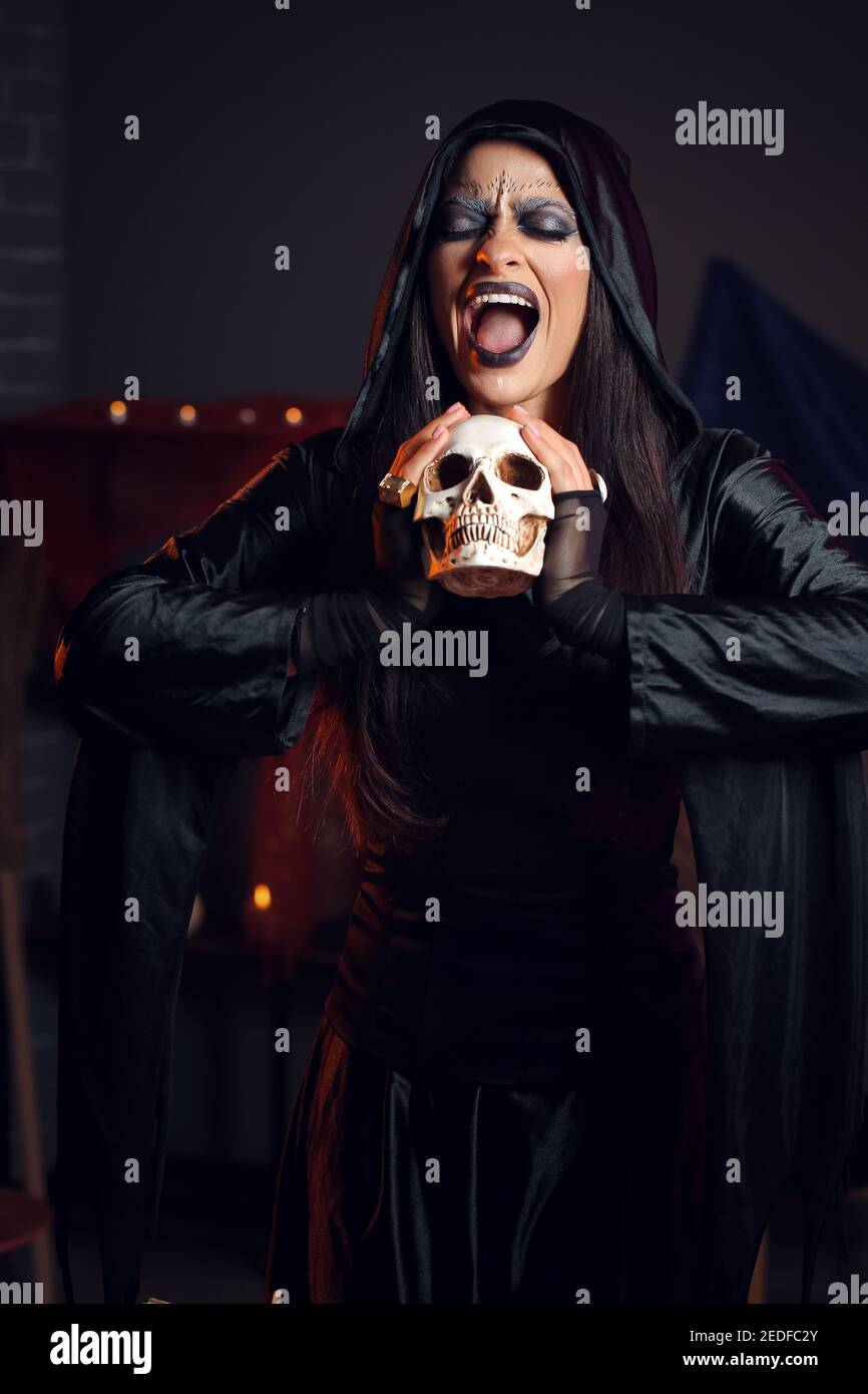 Witch performing black magic ritual Stock Photo - Alamy