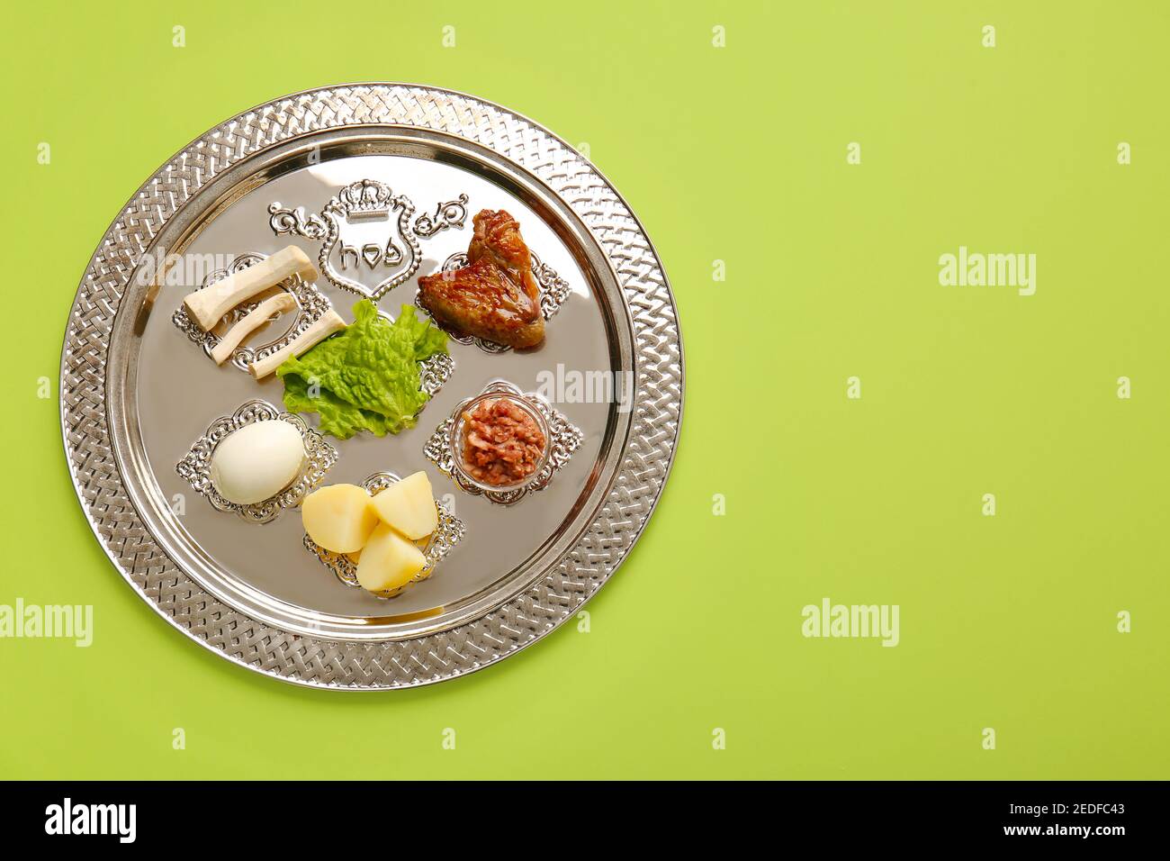 Passover Seder plate with traditional food on color background Stock ...