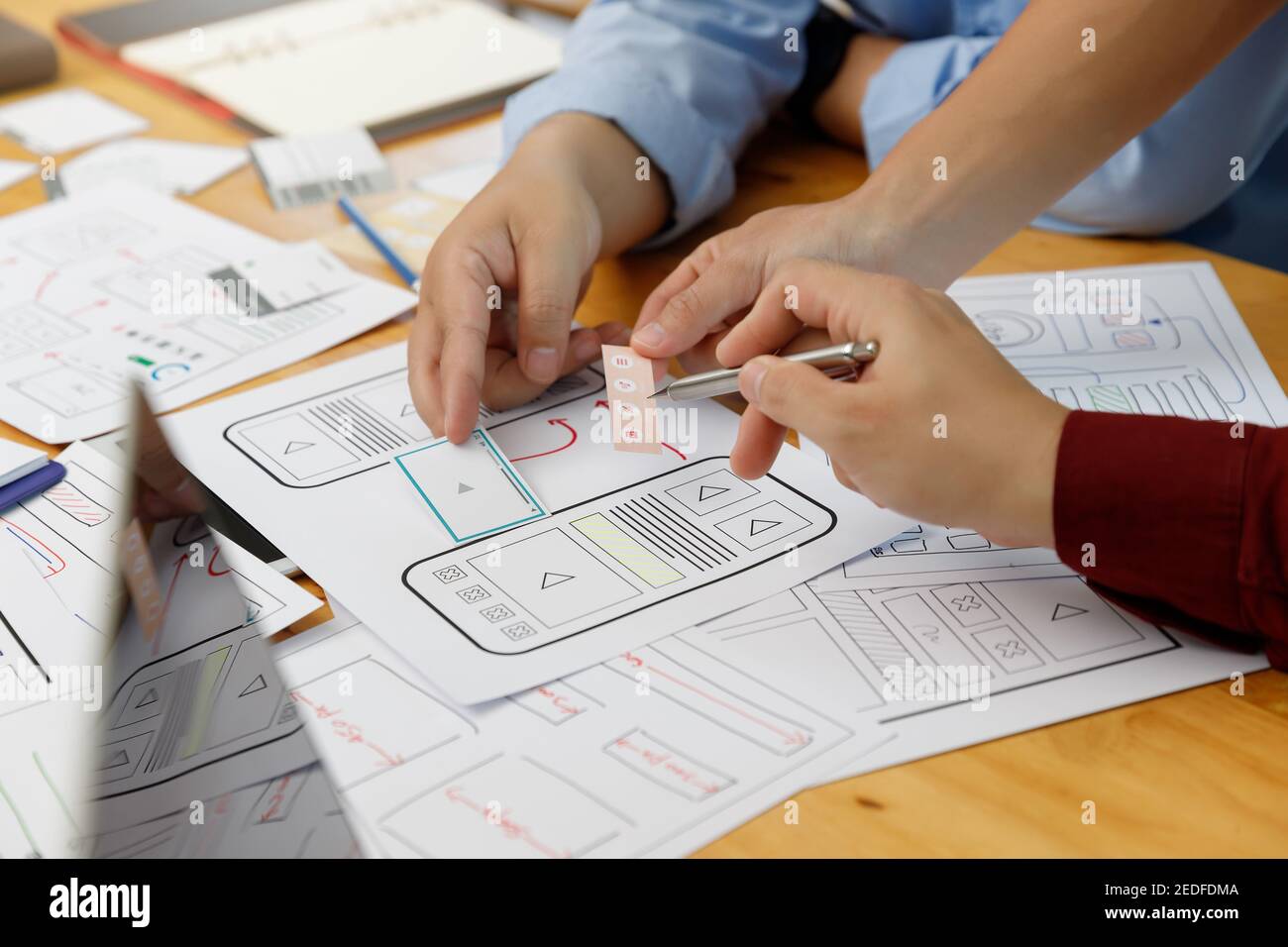 Graphic designers work together with UX UI designer planning ...