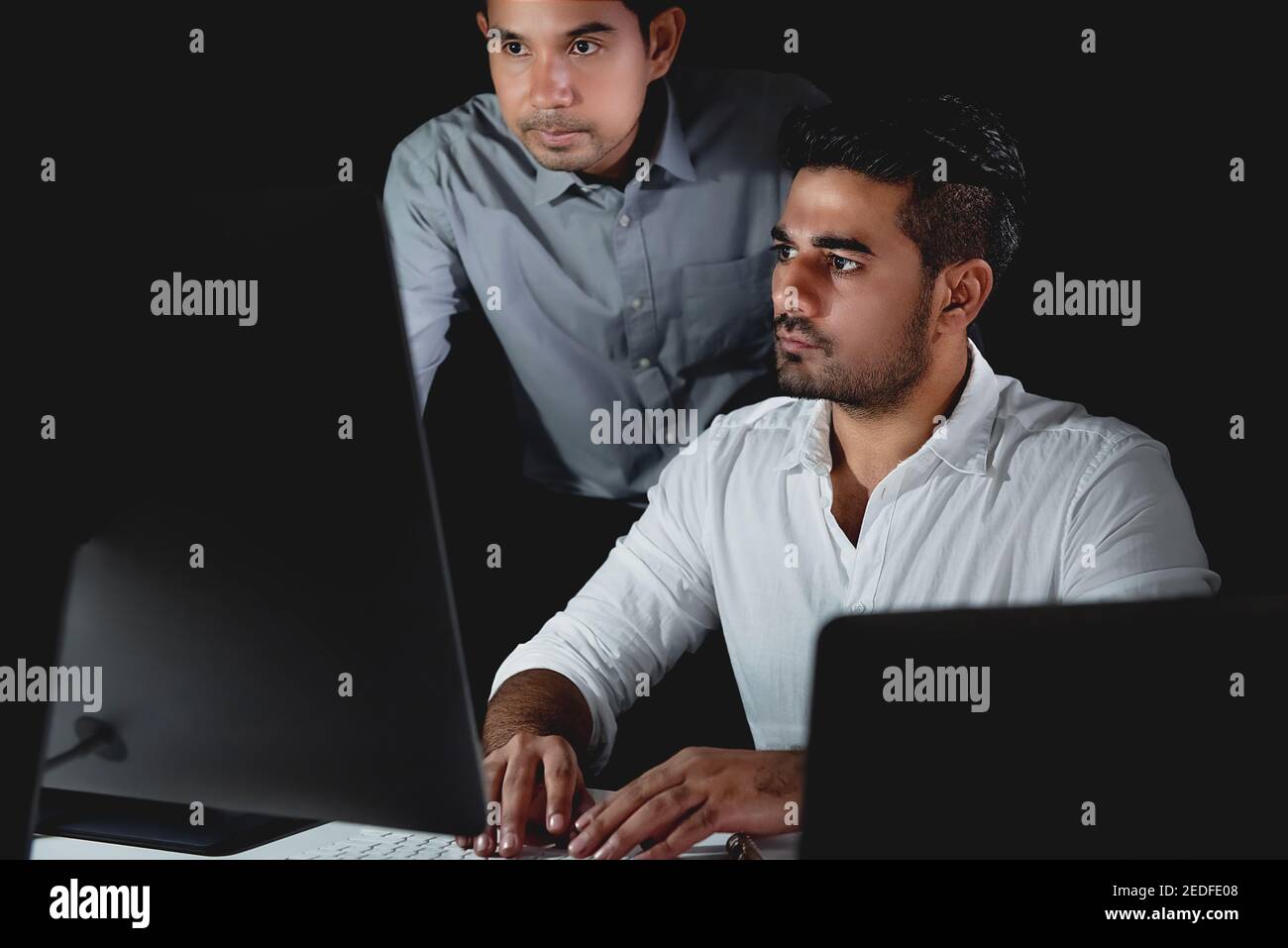 Asian businessman coworkers working night shift in the office ...