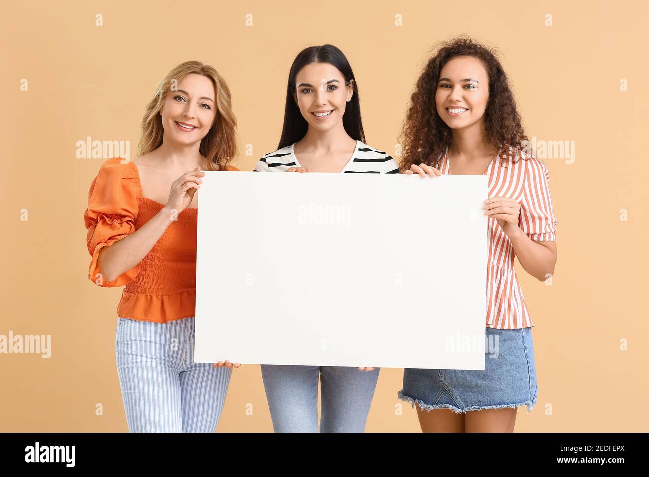 Beautiful women with blank poster on color background. International ...