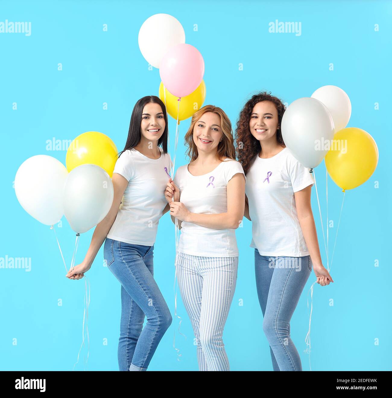 Beautiful women with balloons on color background. International Women ...