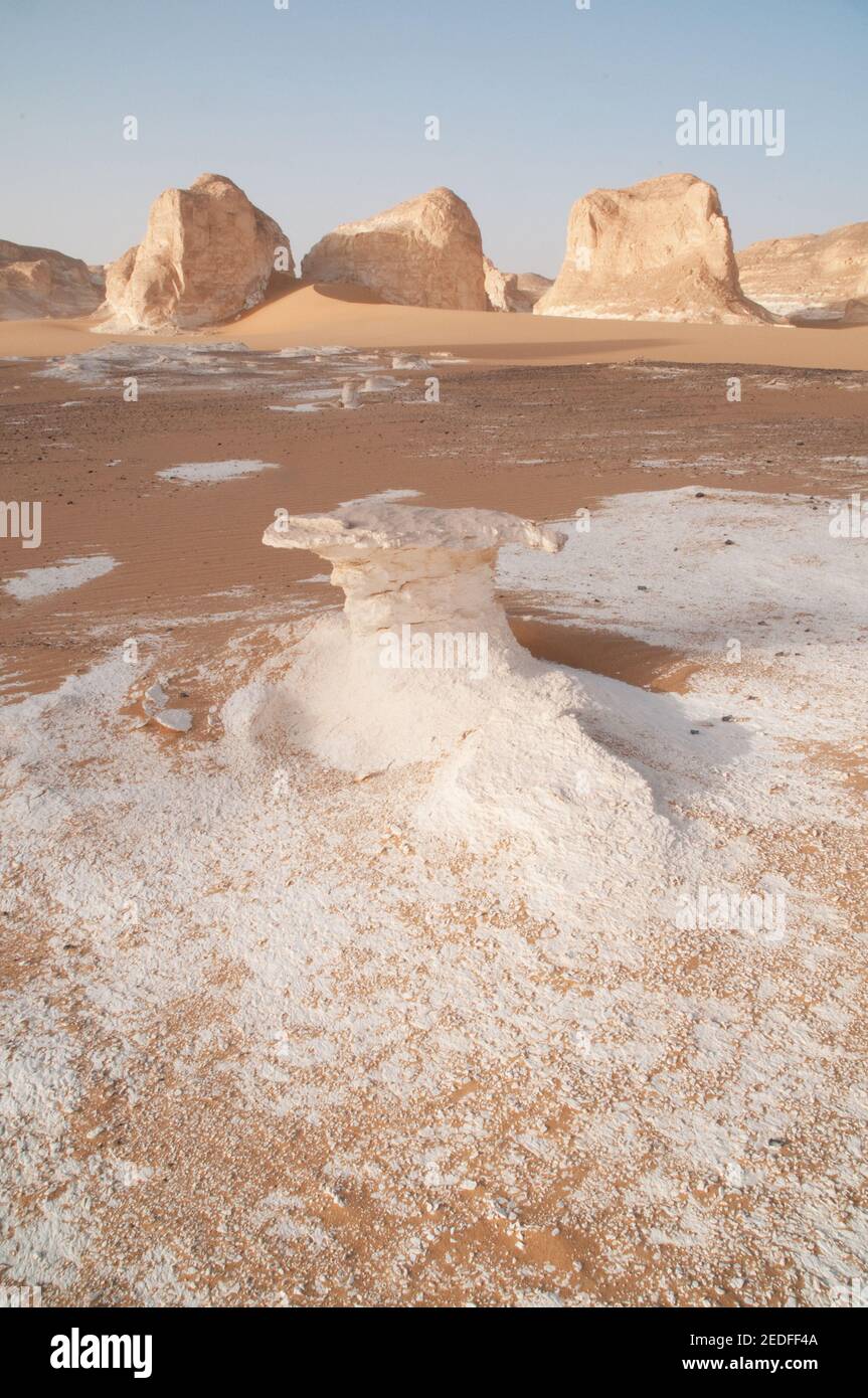 White chalk rock formations and inselbergs mixed with sand in White ...