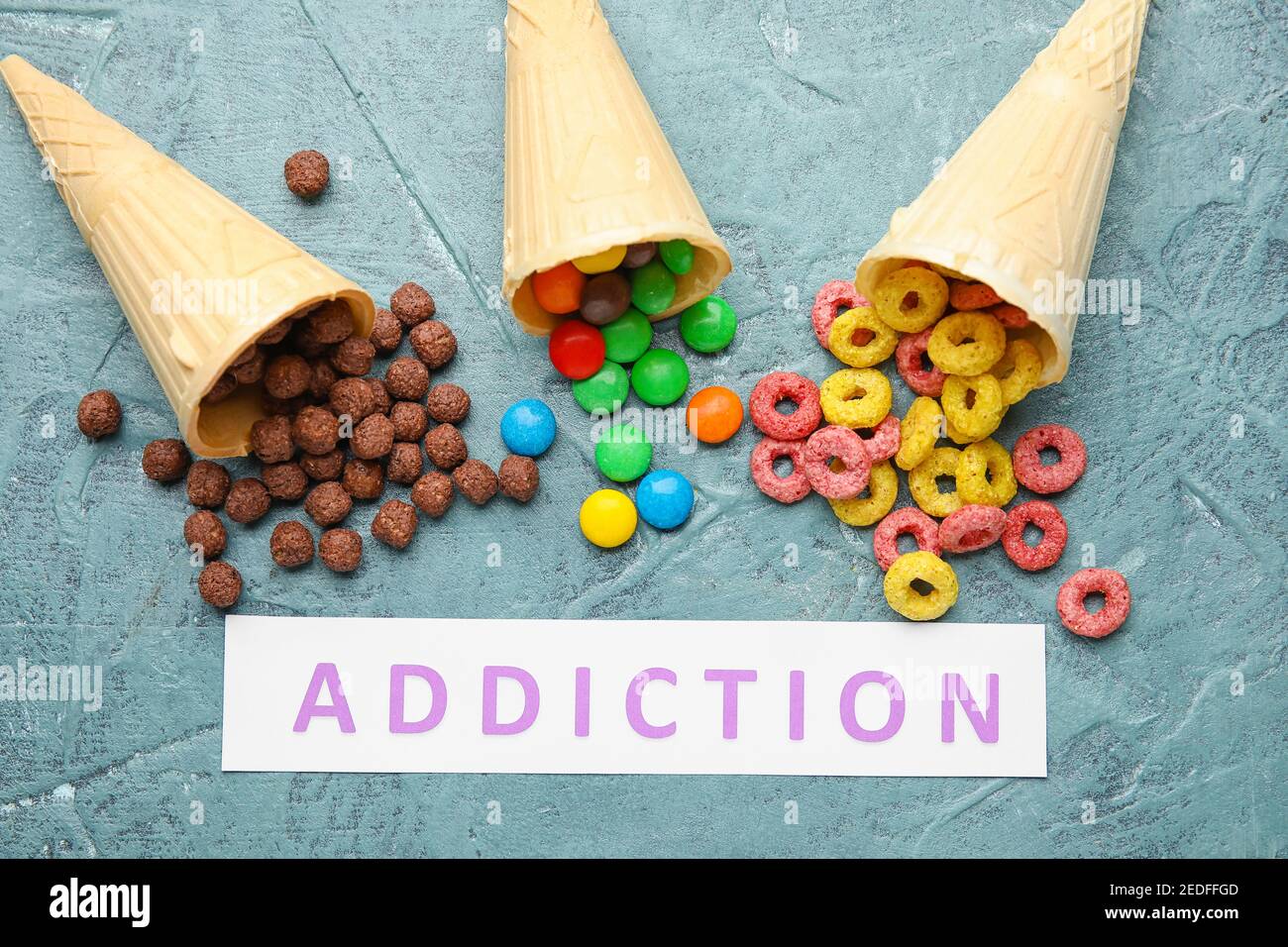 Different sweets on color background. Concept of addiction Stock Photo ...