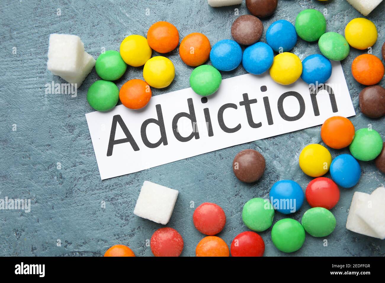 Different sweets on color background. Concept of addiction Stock Photo ...