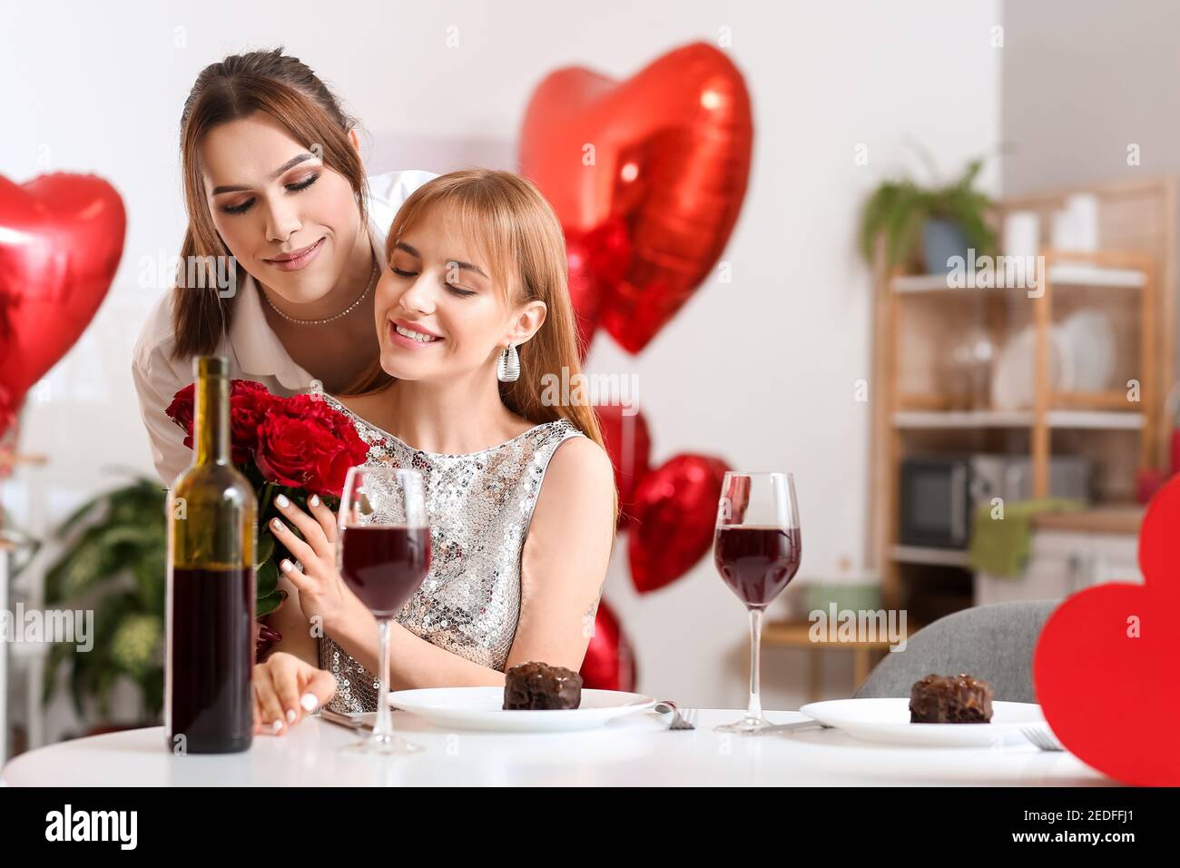 Happy transgender couple celebrating Valentine's Day at home Stock ...
