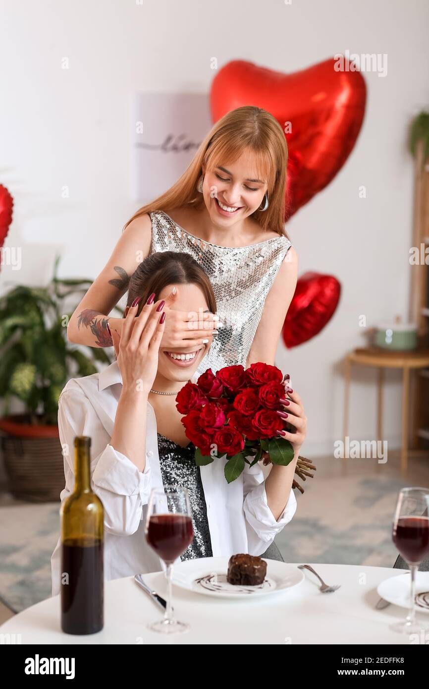 Happy transgender couple celebrating Valentine's Day at home Stock ...