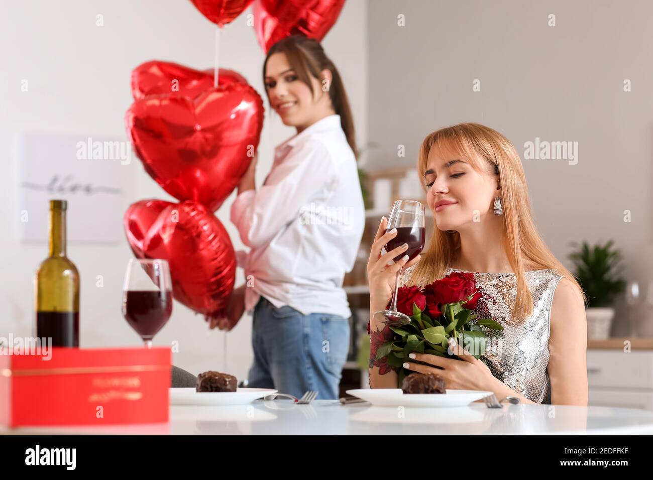 Happy transgender couple celebrating Valentine's Day at home Stock ...