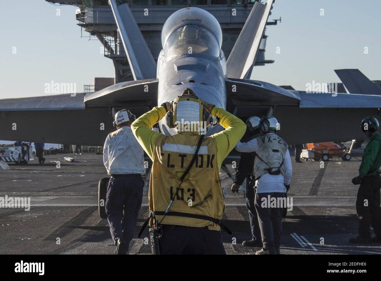 Nimitz Sailor directs Hornet onto catapult 141104 Stock Photo - Alamy