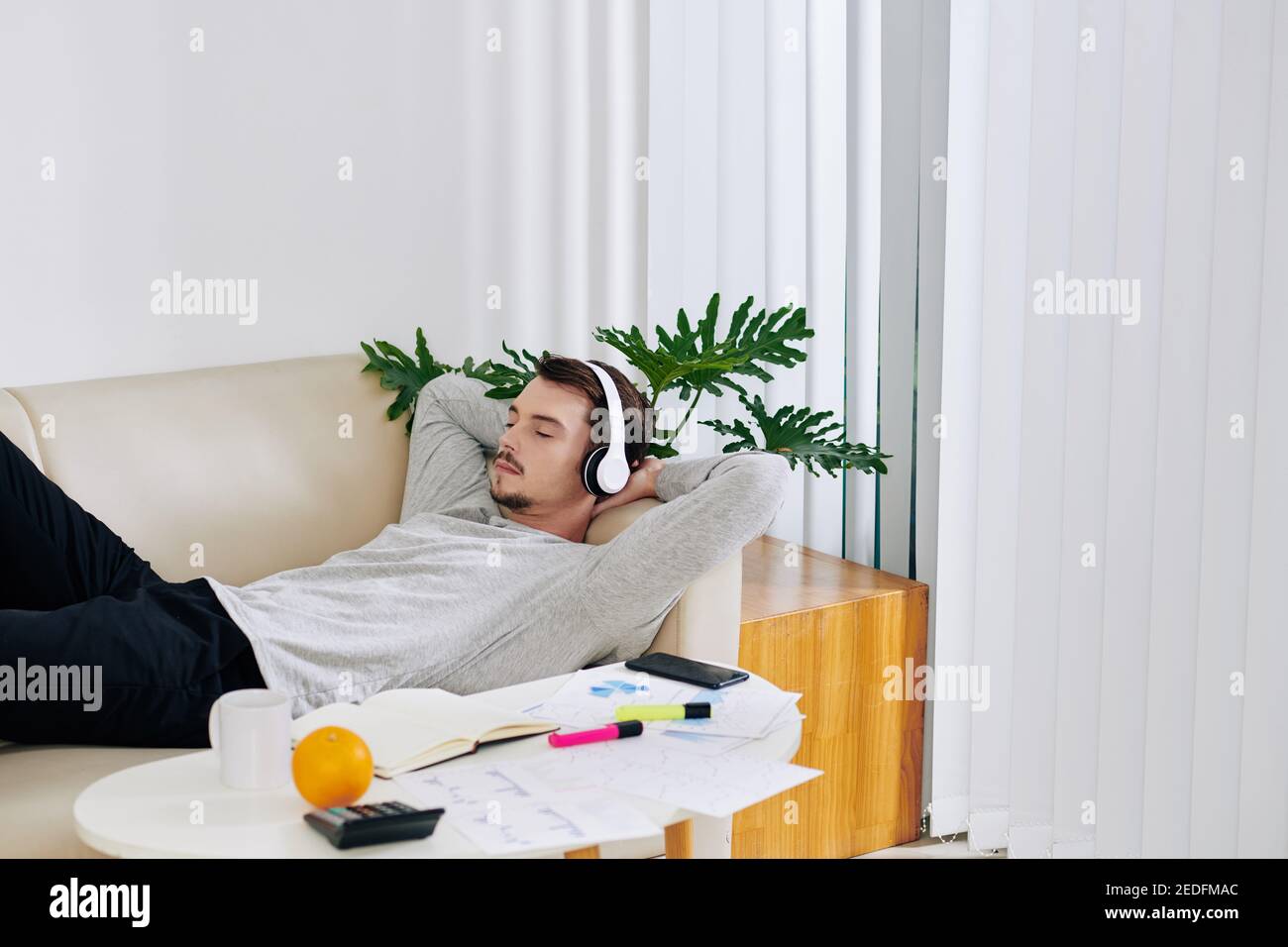 Businessman sleeping after work Stock Photo - Alamy