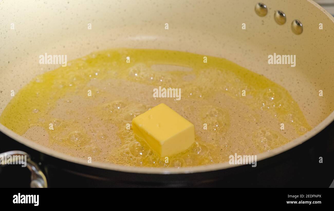Frying pan with melted butter close up, cooking process, recipe ...