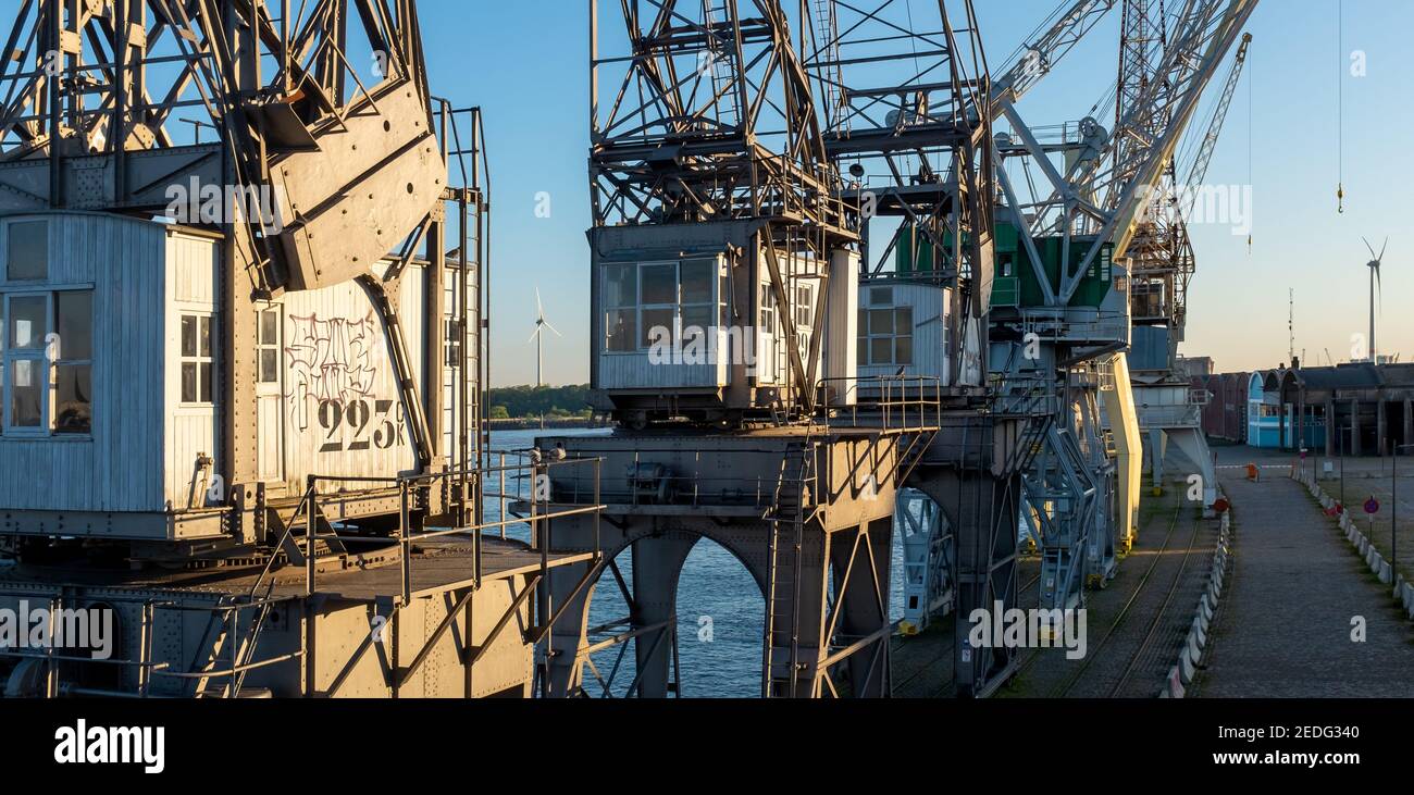 Old harbor cranes in the center of Antwerp. The cranes are part of the ...