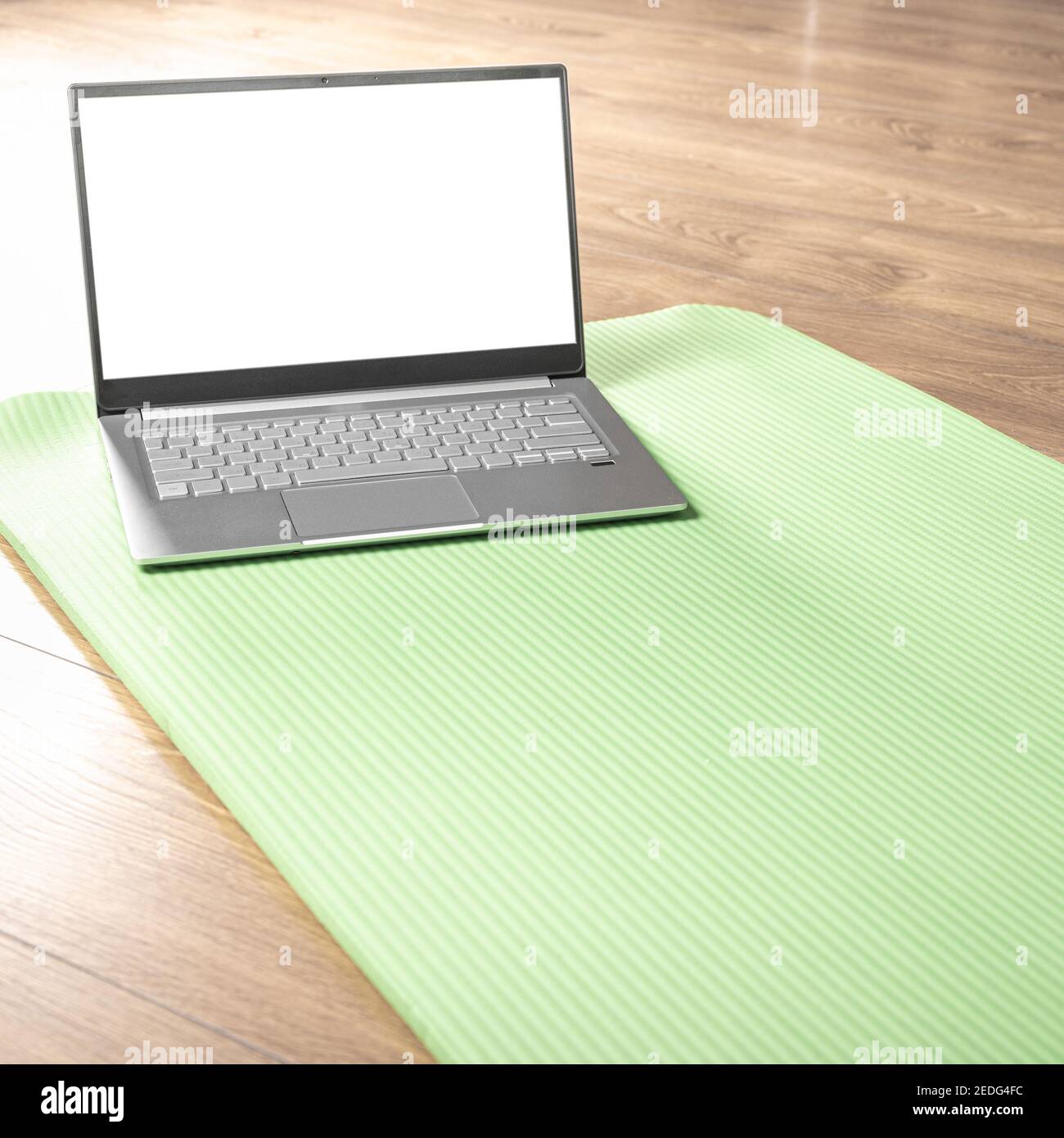 online yoga fitness, laptop mockup. Pink dumbbells, gym mat and grey ...