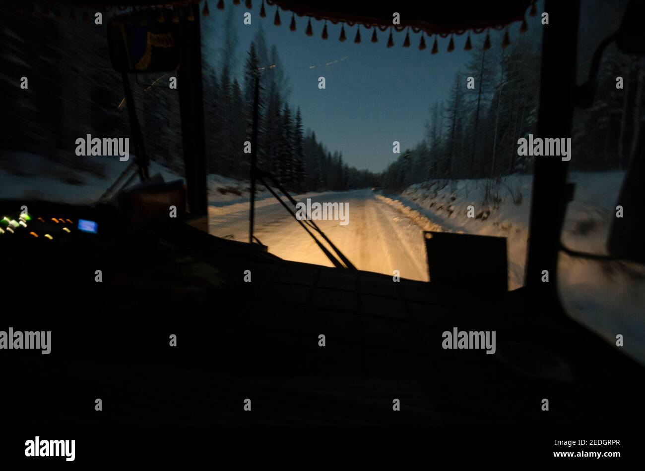 View from the bus window. Winter road trip Stock Photo - Alamy