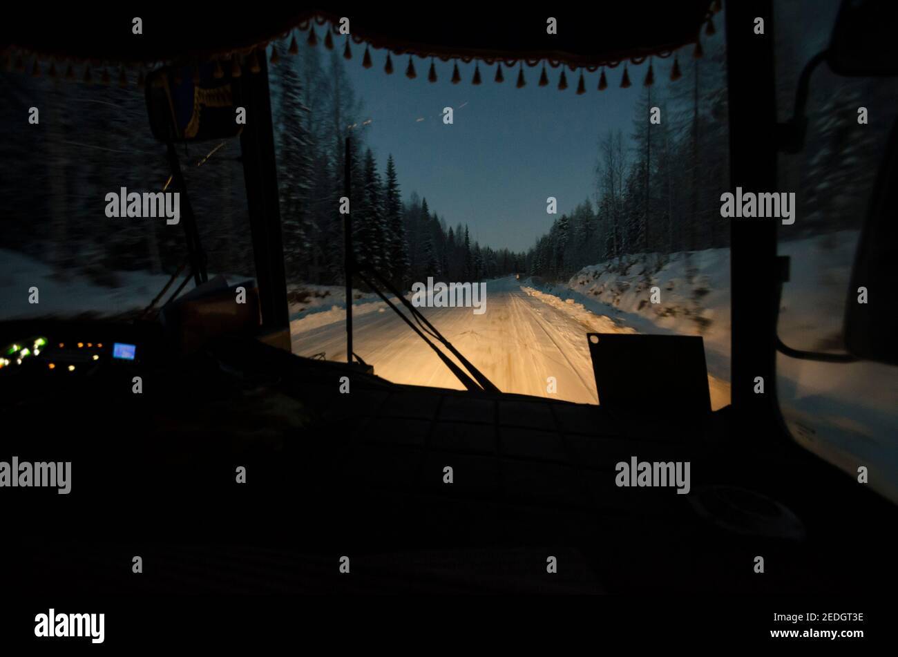 View from the bus window. Winter road trip Stock Photo - Alamy