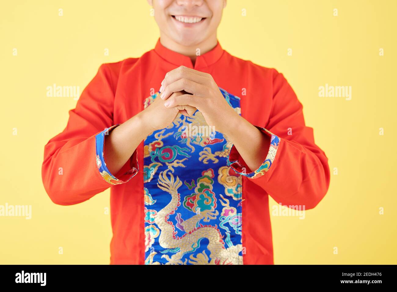 Man making greeting gesture Stock Photo - Alamy