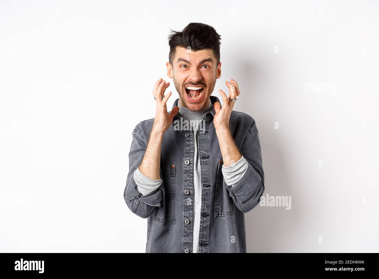Angry man screaming distressed, losing temper and shouting frustrated ...