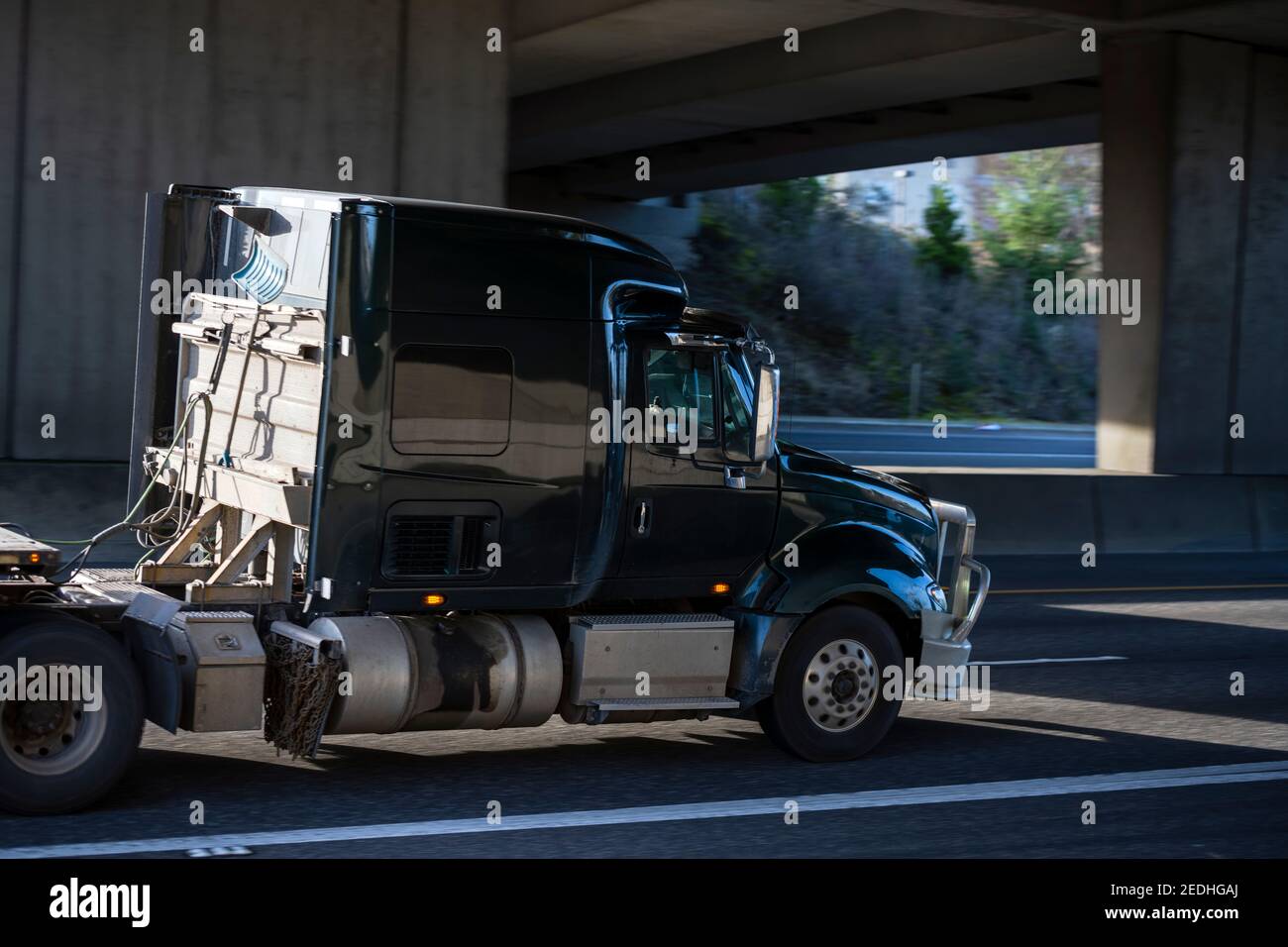 Big rig black semi truck tractor with long cab and auxiliary equipment ...