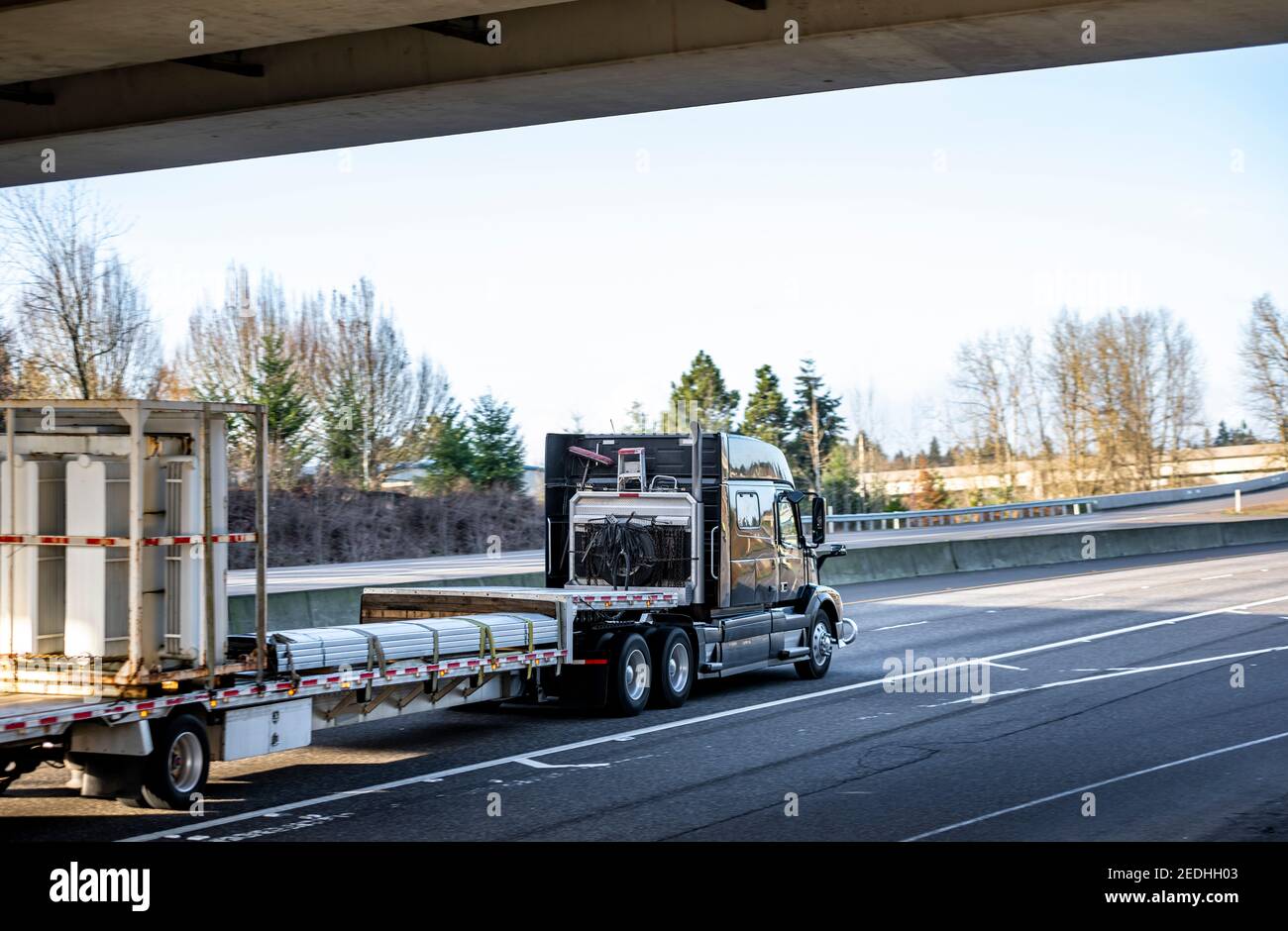 Big rig industrial black semi truck tractor with low roof cab and ...