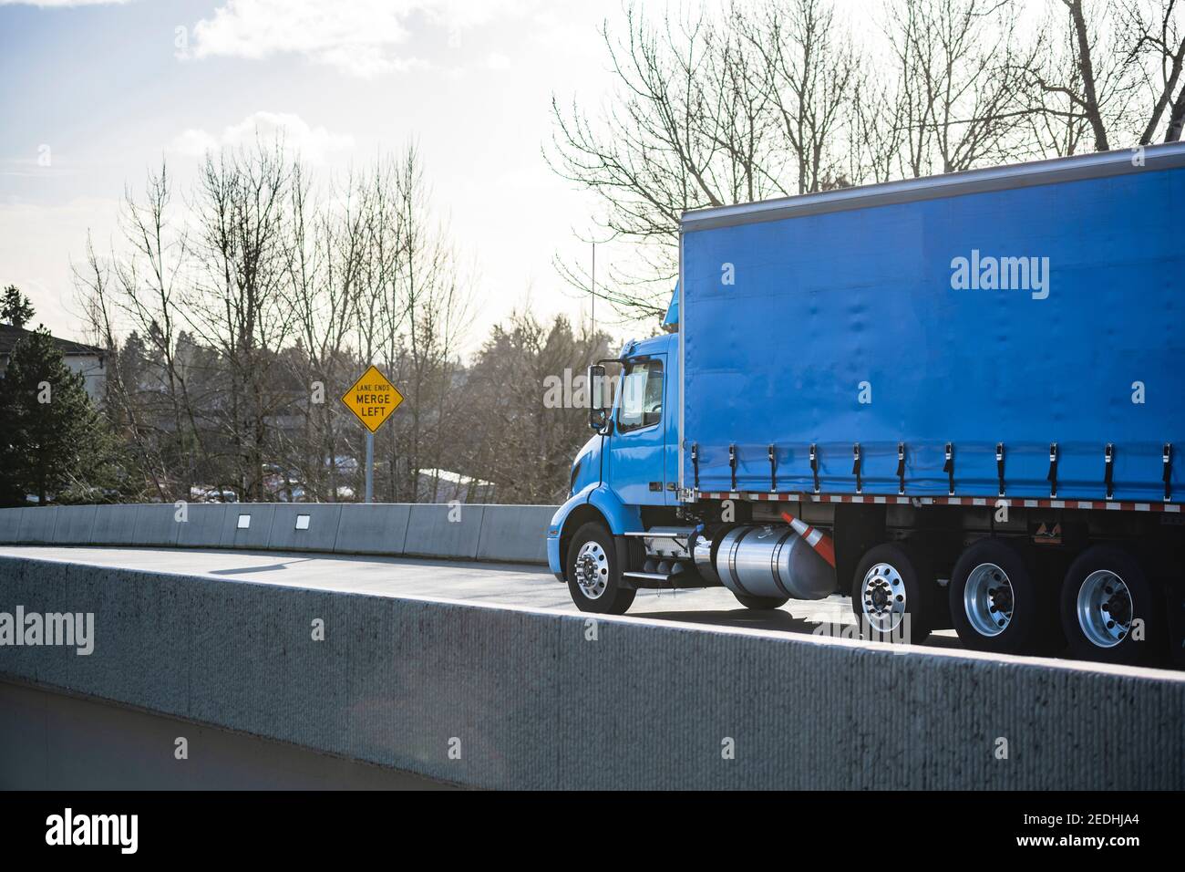 Classic big rig day cab blue semi truck tractor with dry van box ...