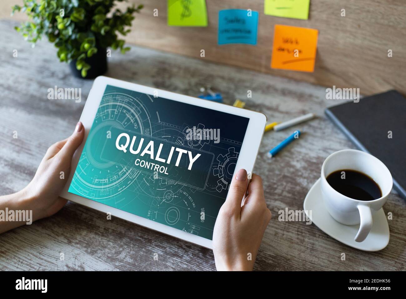 Quality control concept on device screen. Business and technology ...