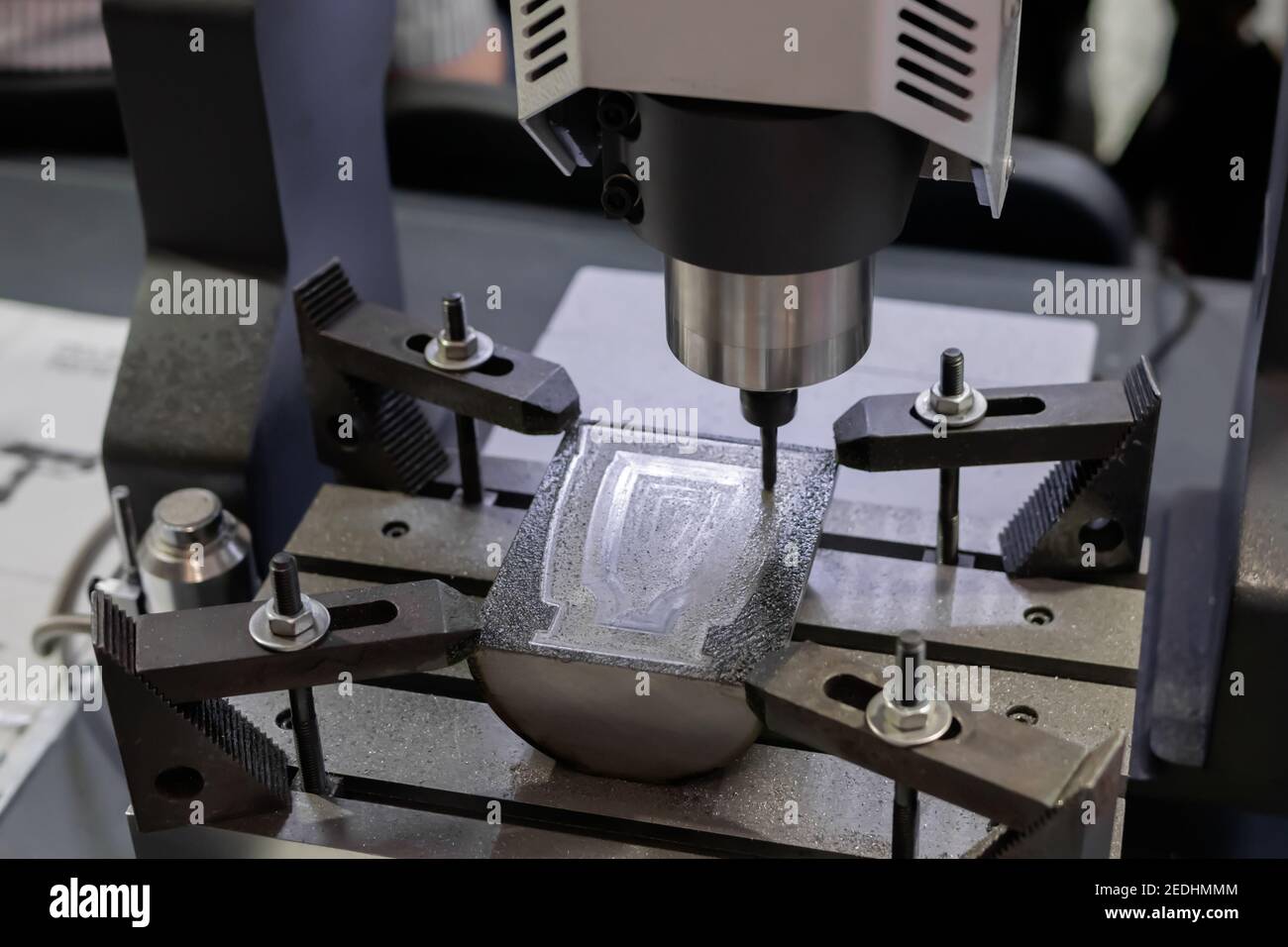 Automatic turning milling machine cutting metal workpiece at factory ...