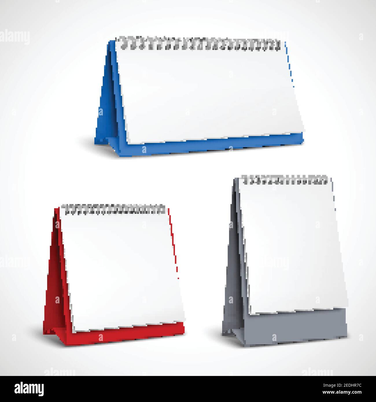 Set of blank table spiral calendars of various size and color on white ...