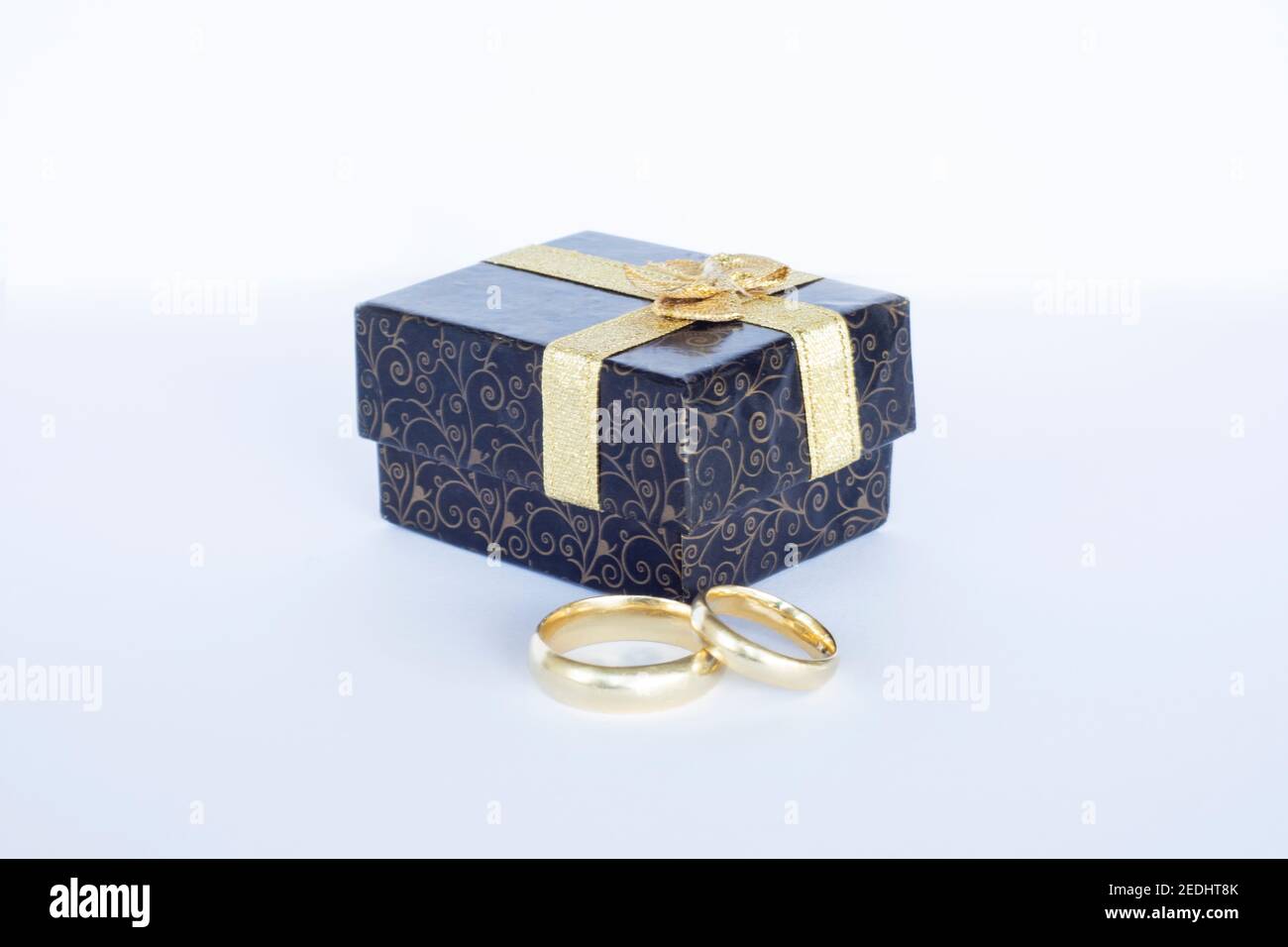 Wedding Rings and Little Jewelery Box. mall cardboard box decorated ...