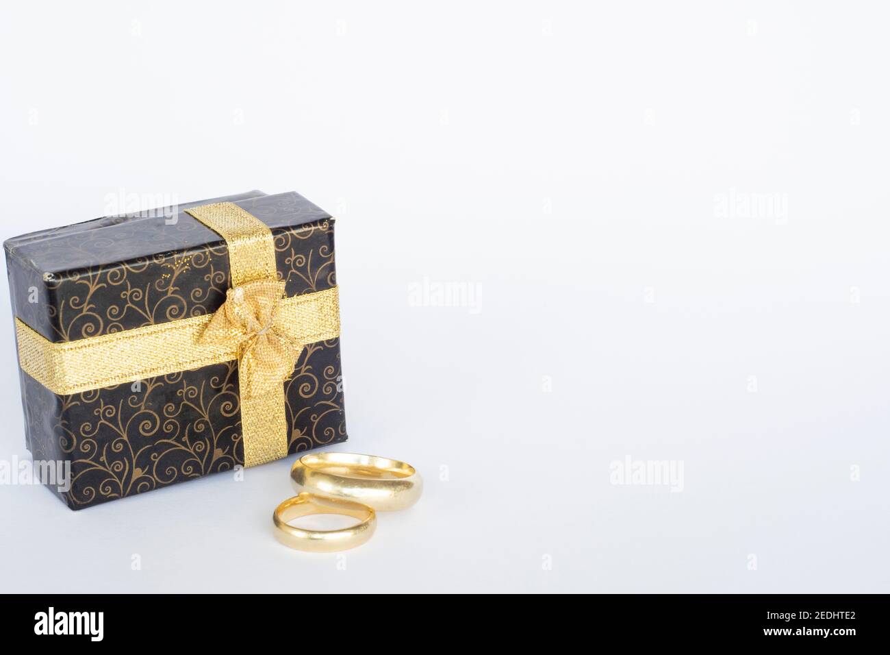 Wedding Rings and Little Jewelery Box. mall cardboard box decorated ...