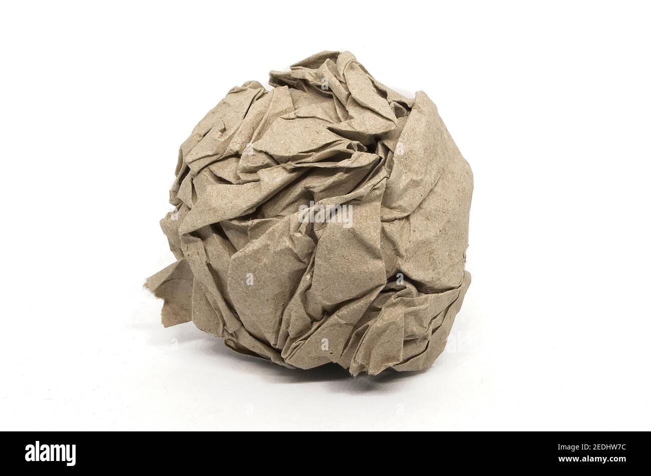 Crumpled piece of recycled paper on white background. Green waste Stock ...