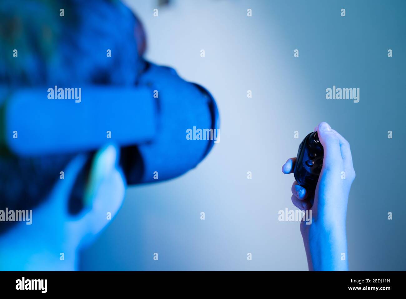 Selective focus on joystick, Shoulder shot of kid with vr or virtual ...