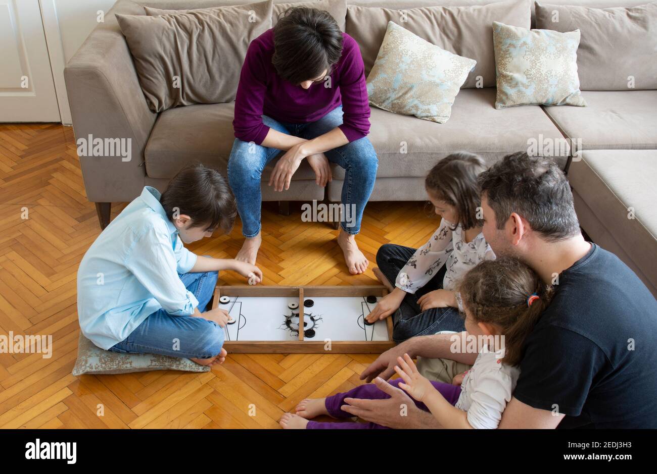 Whole Family playing game. brother and sister match. Sitting on the ...