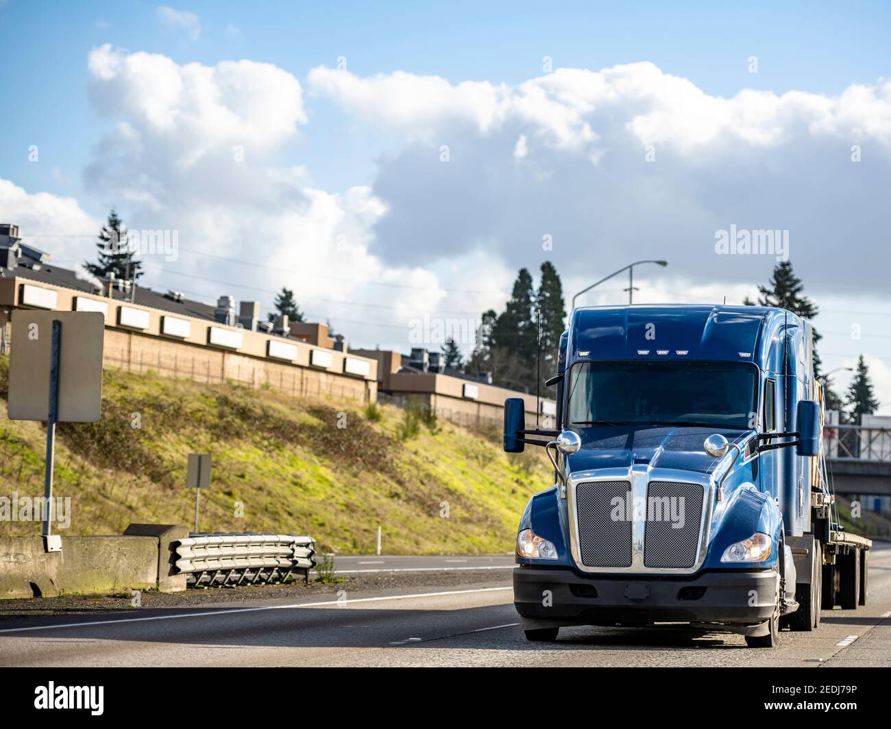 Classic big rig industrial blue semi truck tractor with low roof cab ...