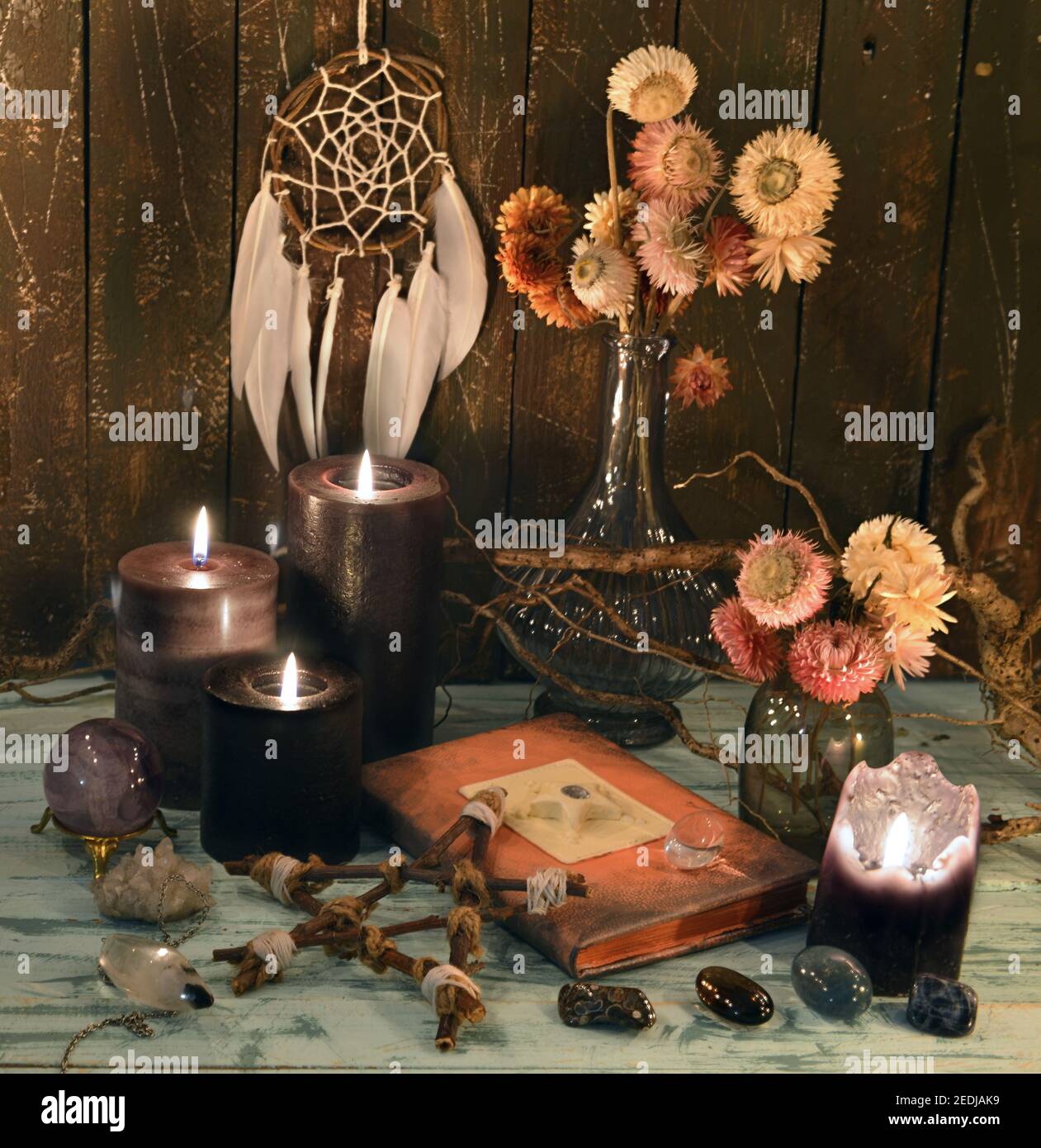 Still life with diary book, black candles, dreamcatcher and dry flowers ...