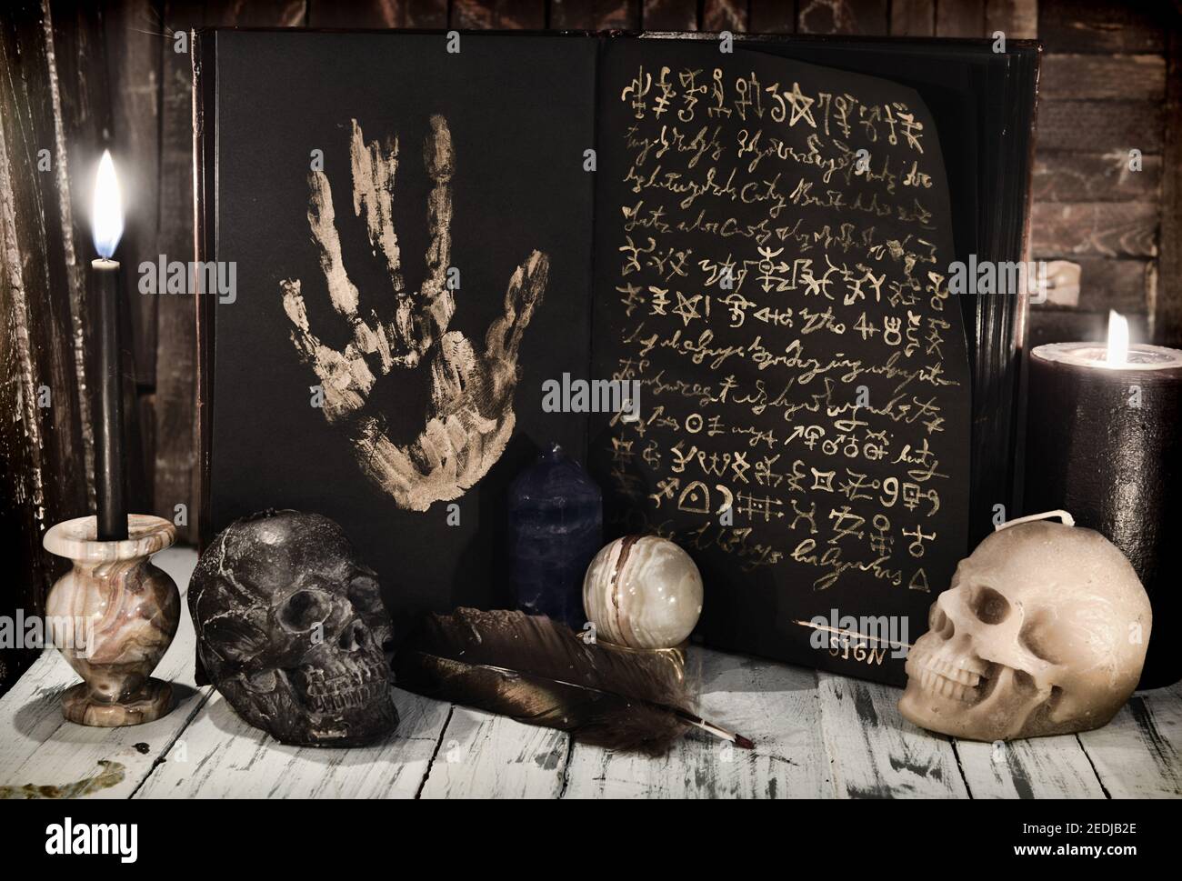 Evil book wih black pages and mystic symbols, burning candles and skull ...
