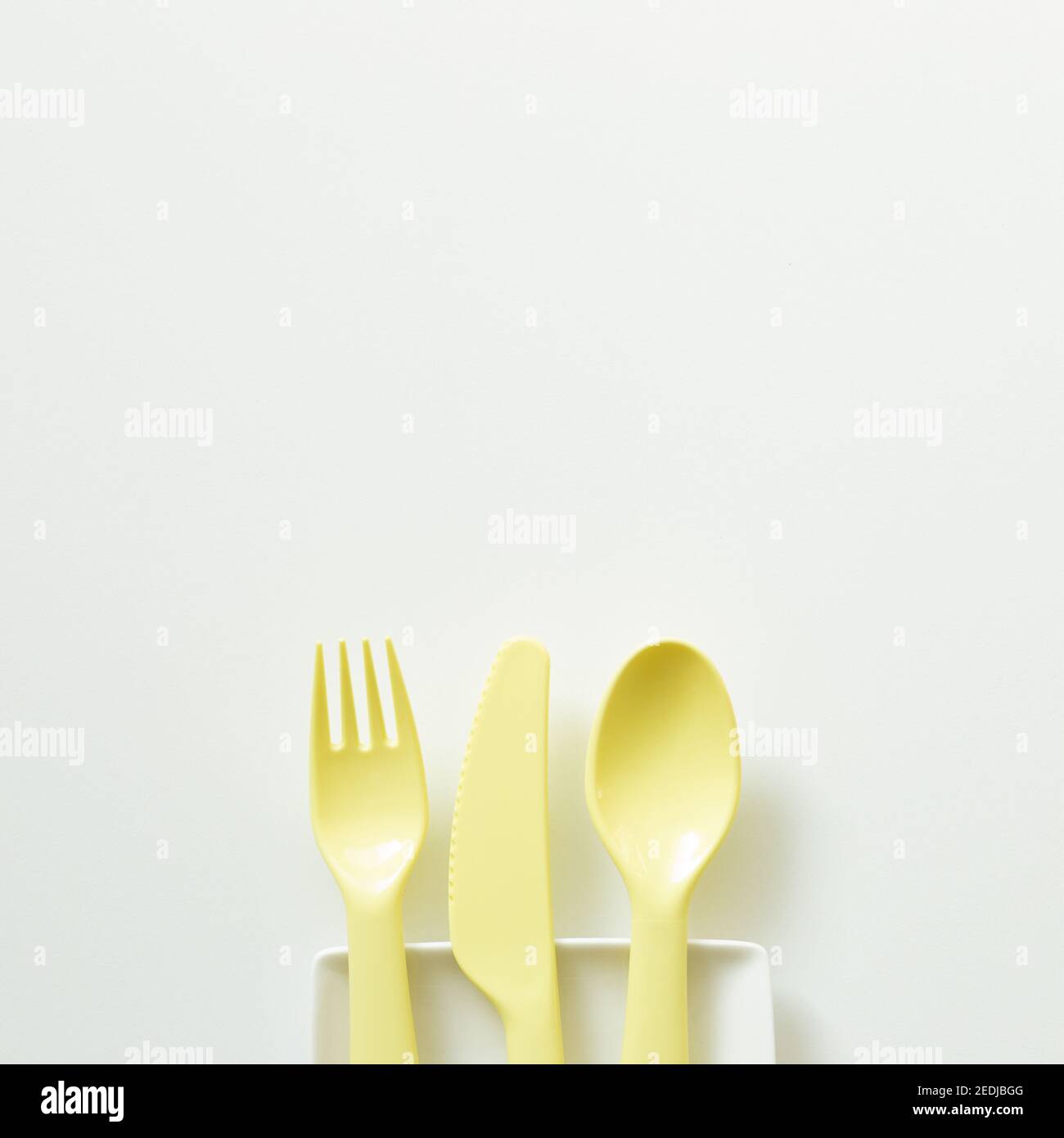 Yellow fork knife spoon on white background. flat lay, top view, copy ...