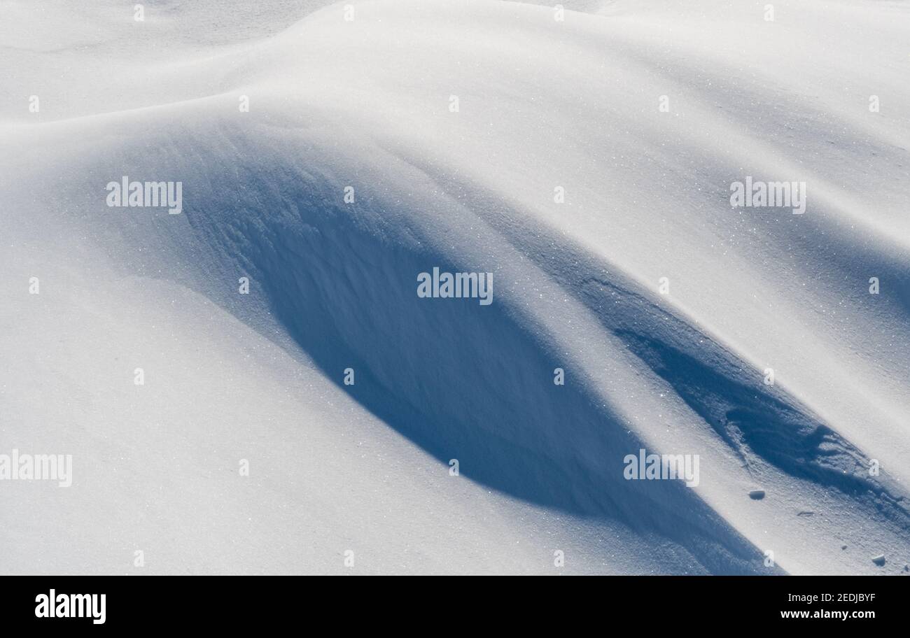 Newly fallen snow in a soft snowdrift background Stock Photo - Alamy