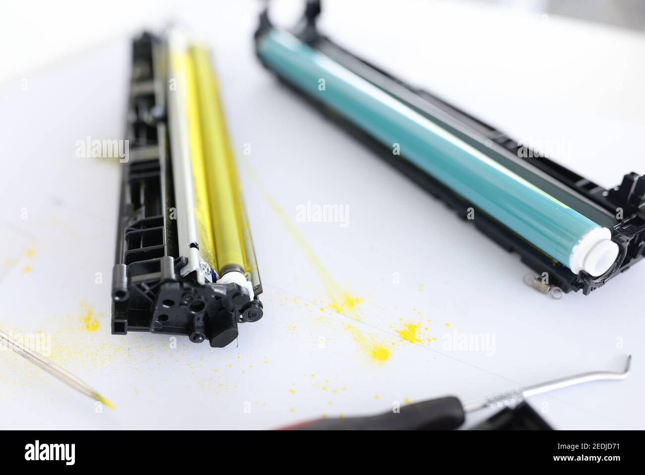 Yellow and blue cartridges for printer lying on table closeup Stock ...