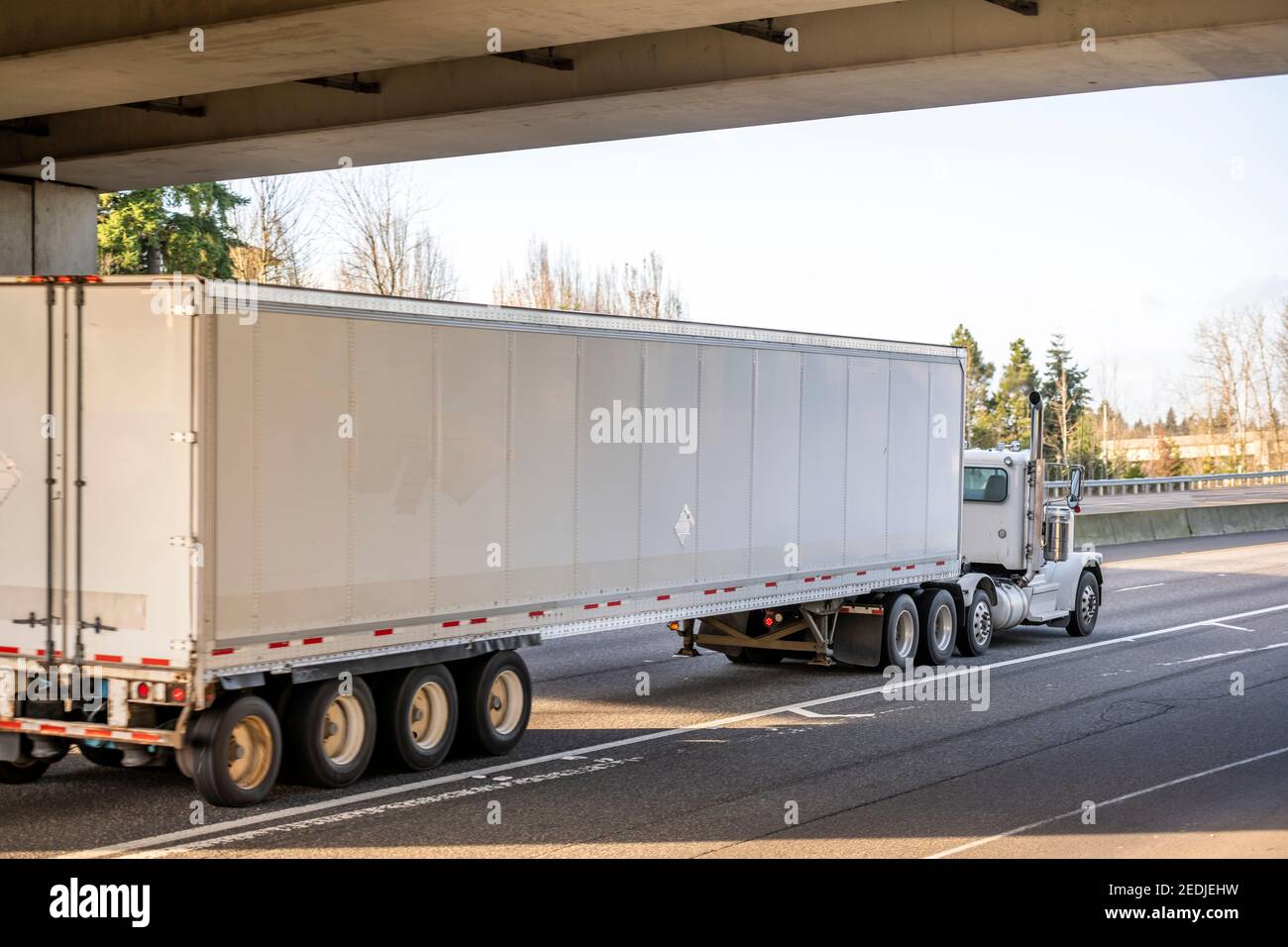 Classic powerful big rig white semi truck tractor with day cab and ...
