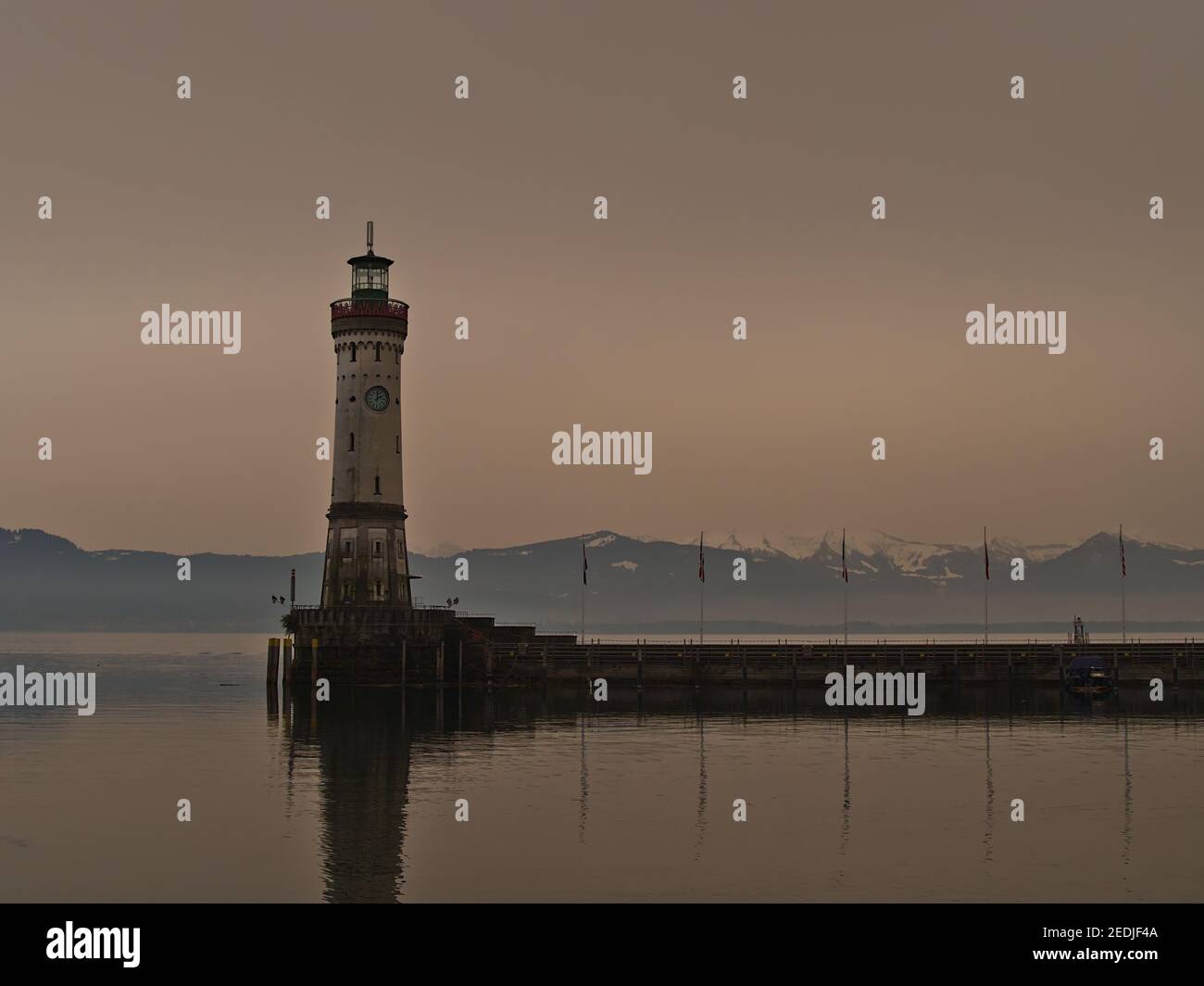 Harbor basin with famous historic Lindau lighthouse on the coast of ...