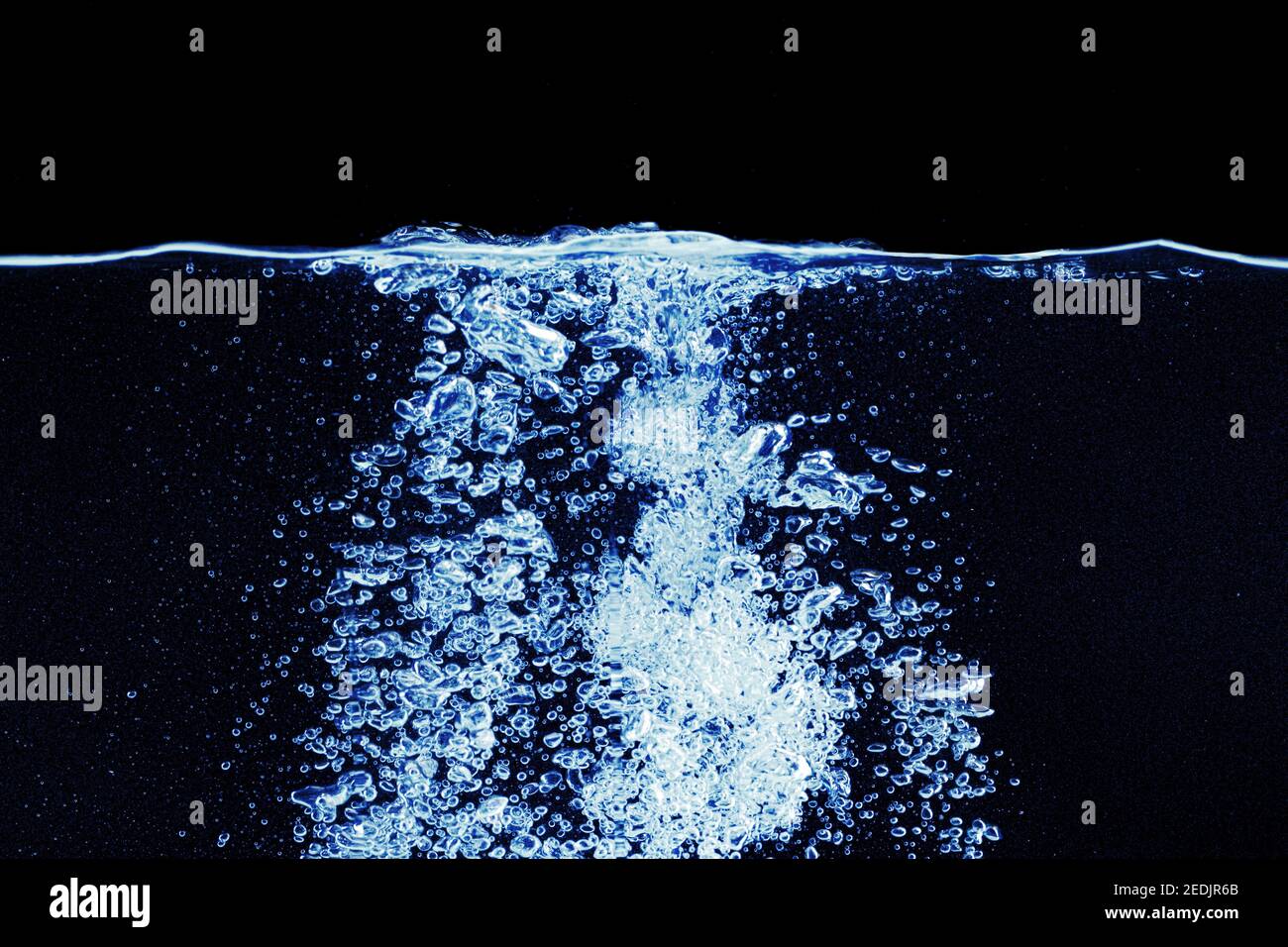 Water splash in aquarium isolated on black background Stock Photo - Alamy
